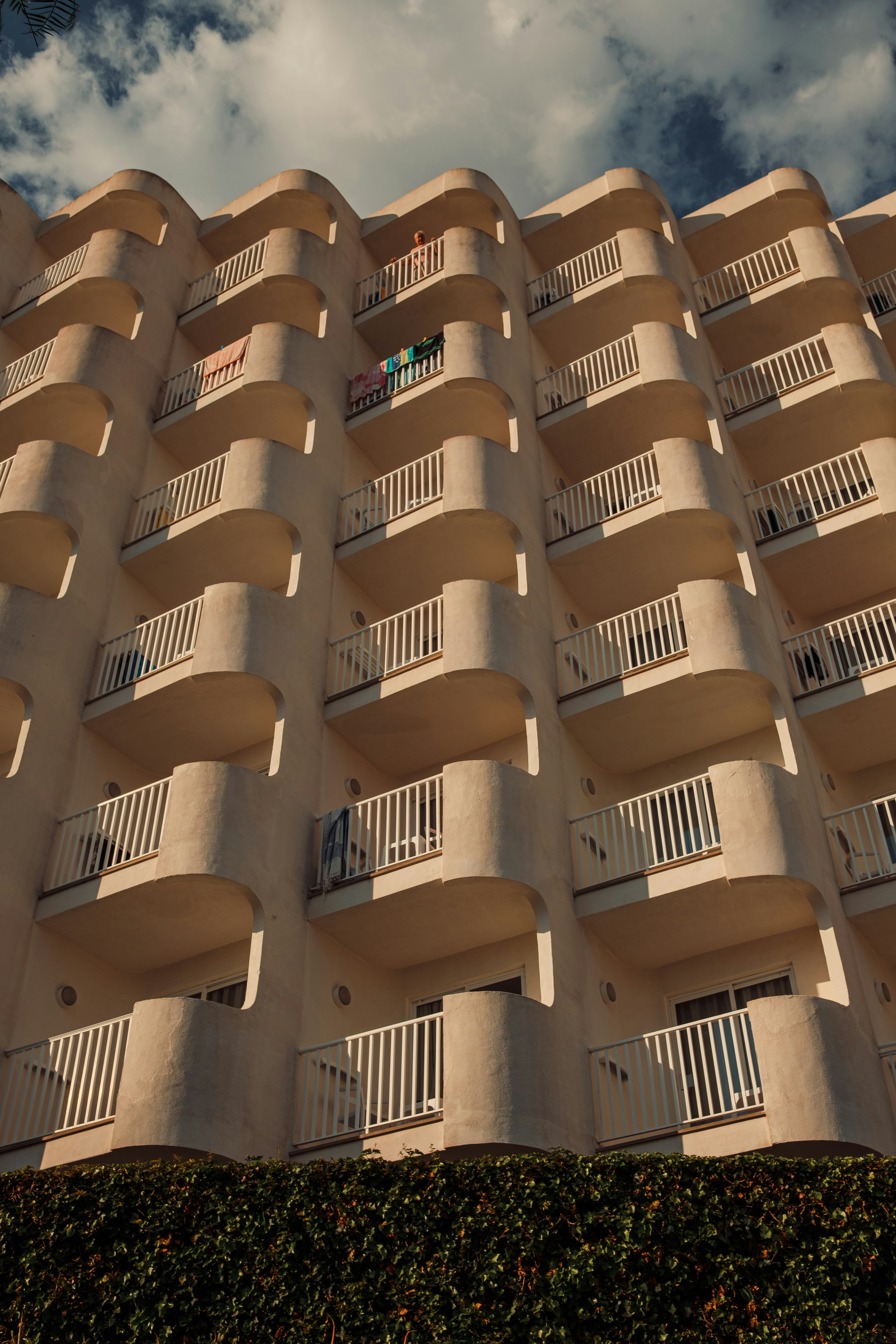 Concrete Waves: Repeated Balconies Reach Toward the Sky