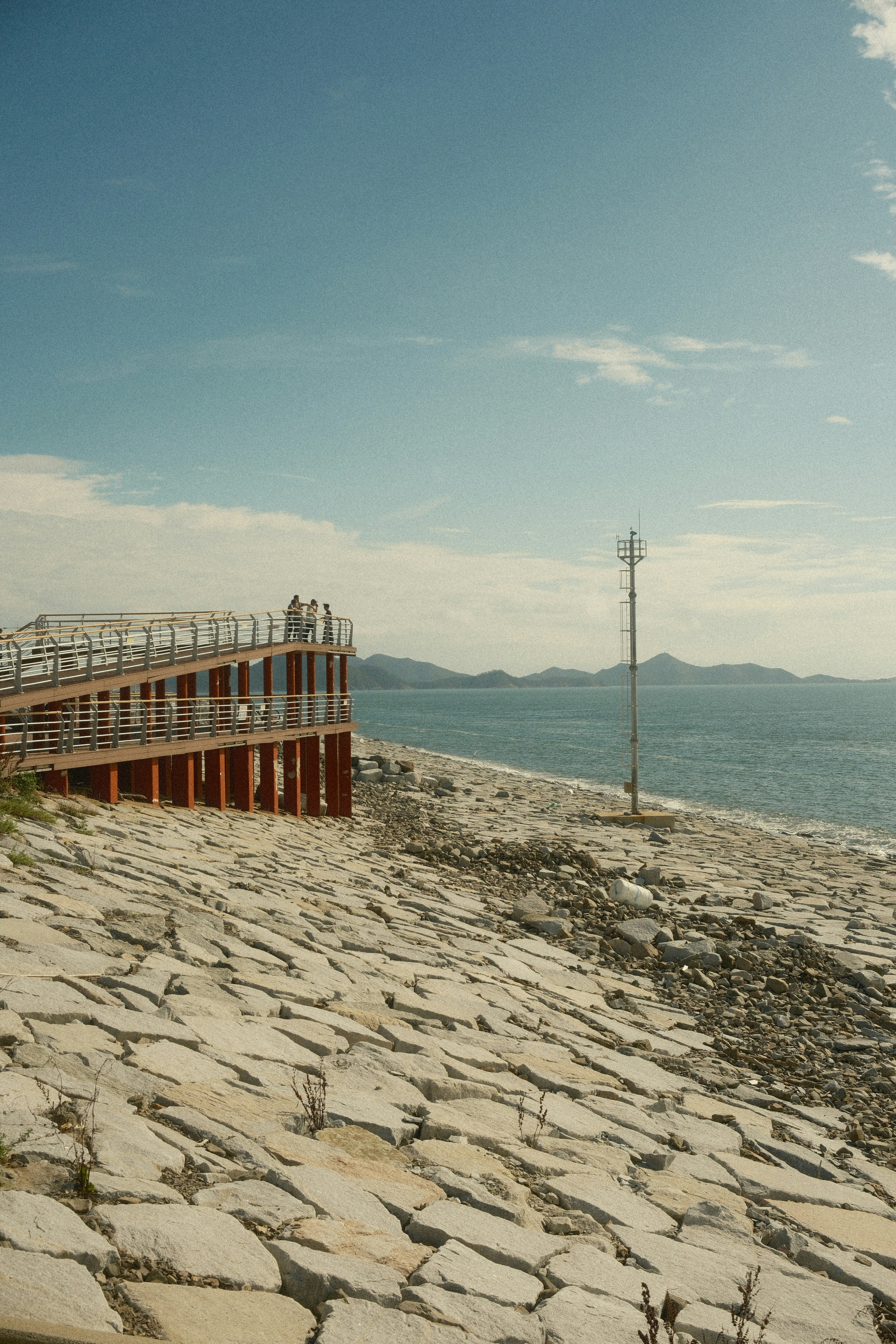Rugged Seaside Deck: Portrait of Rock and Sky