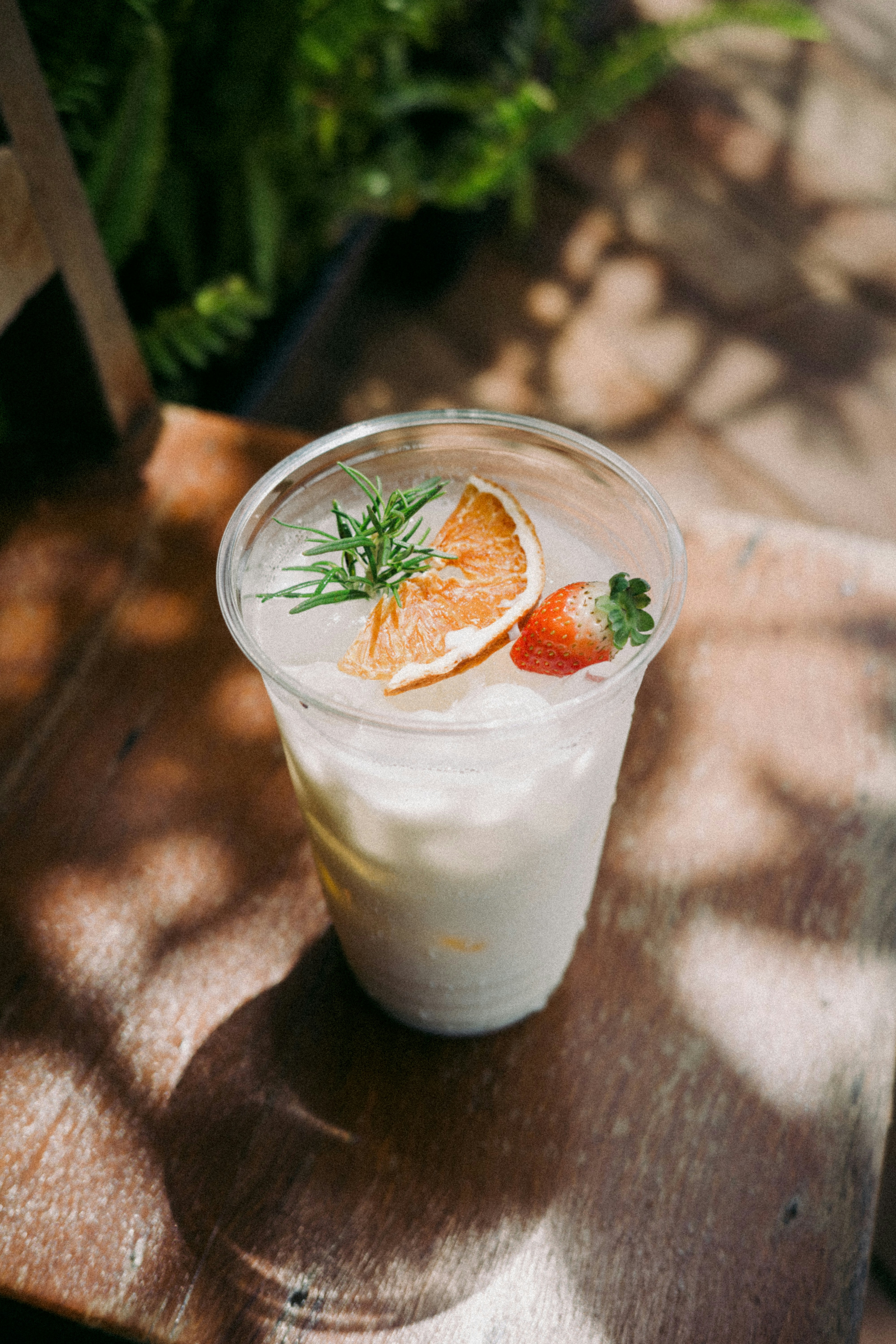 Citrus Sparkle: A Glass of Quiet Refreshment in Sunlit Outdoor Light