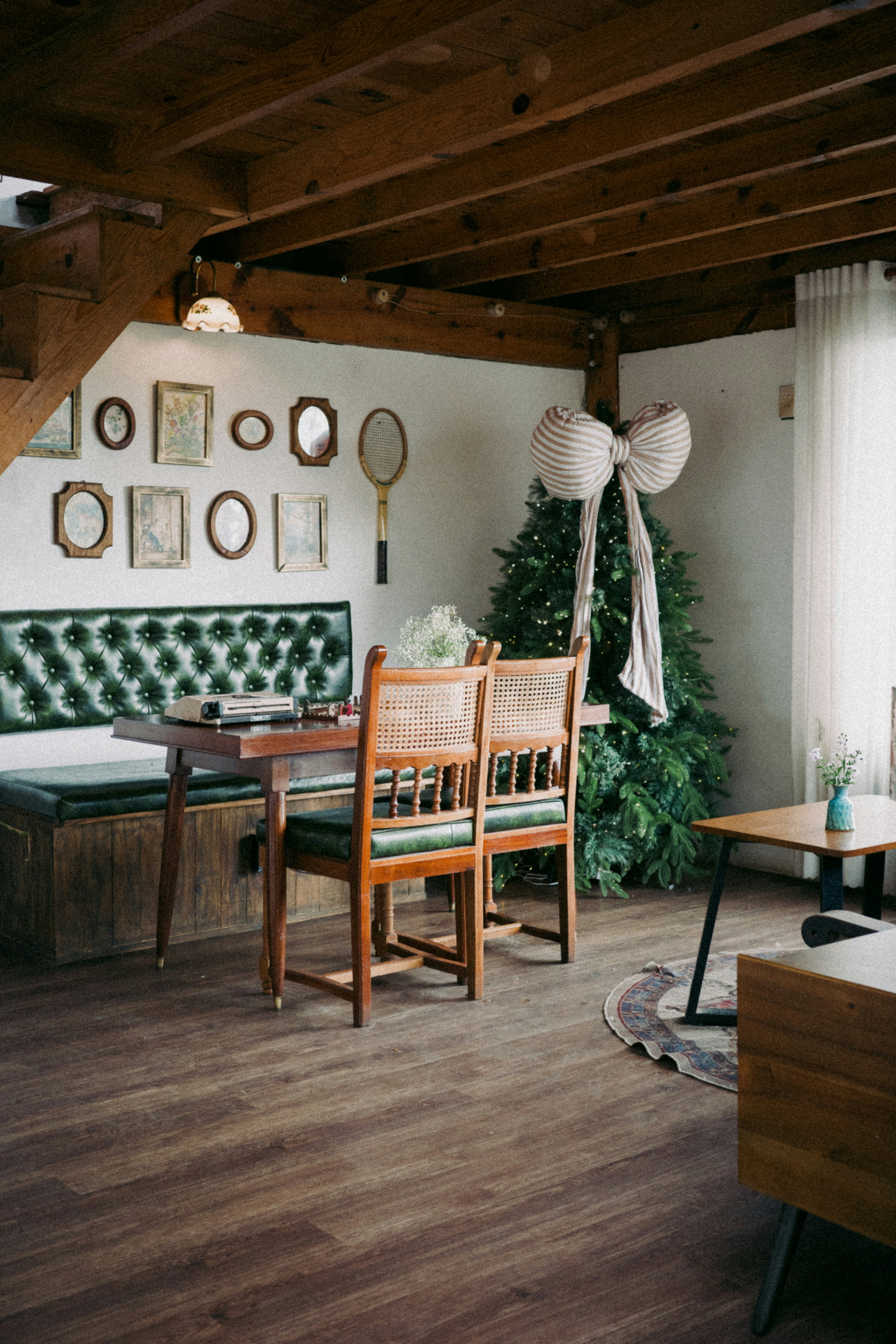 Cozy retro dining nook with a Christmas tree serenading the corner