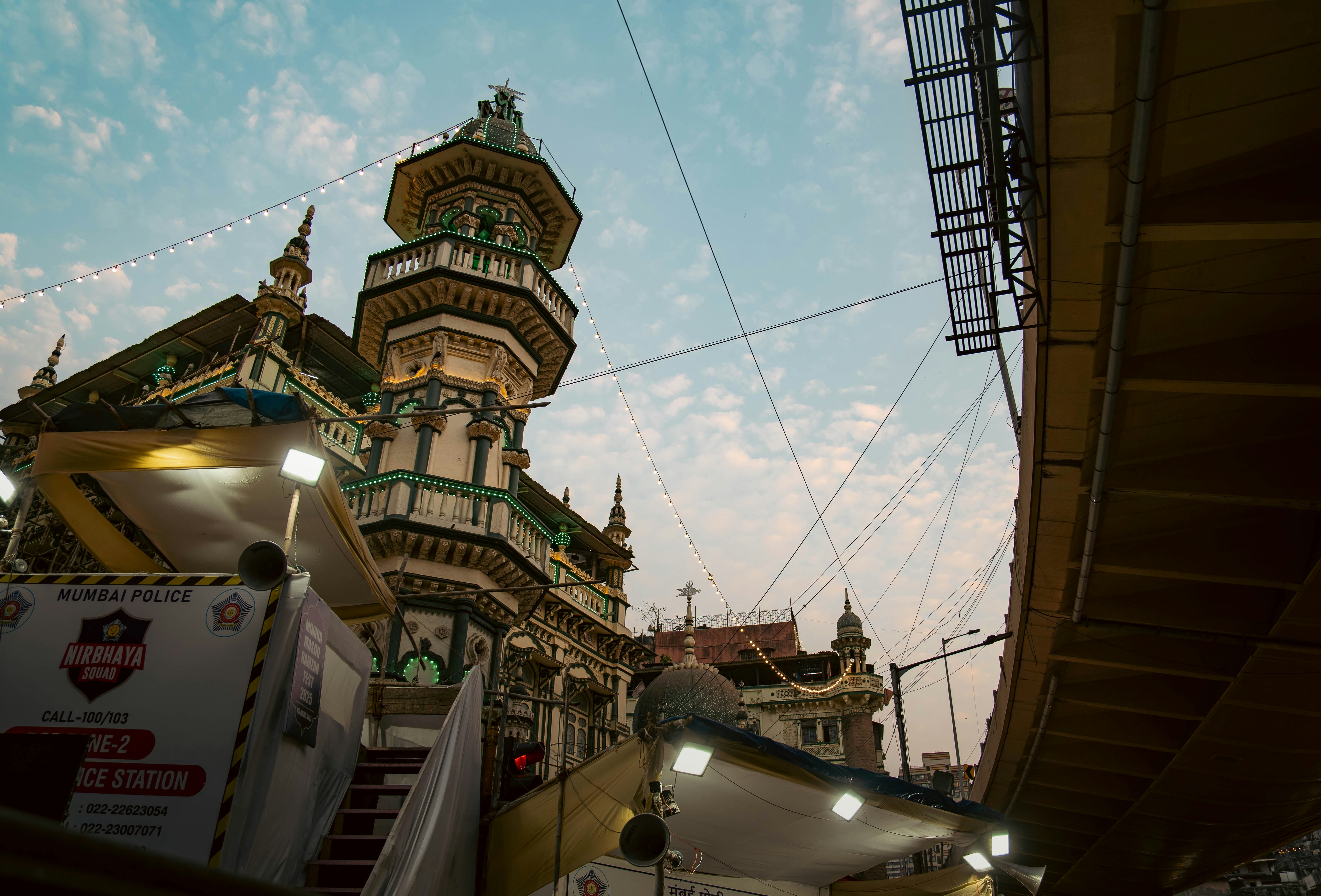 Temple Spire Amid City Light: A Low-Angle Evening in Mumbai