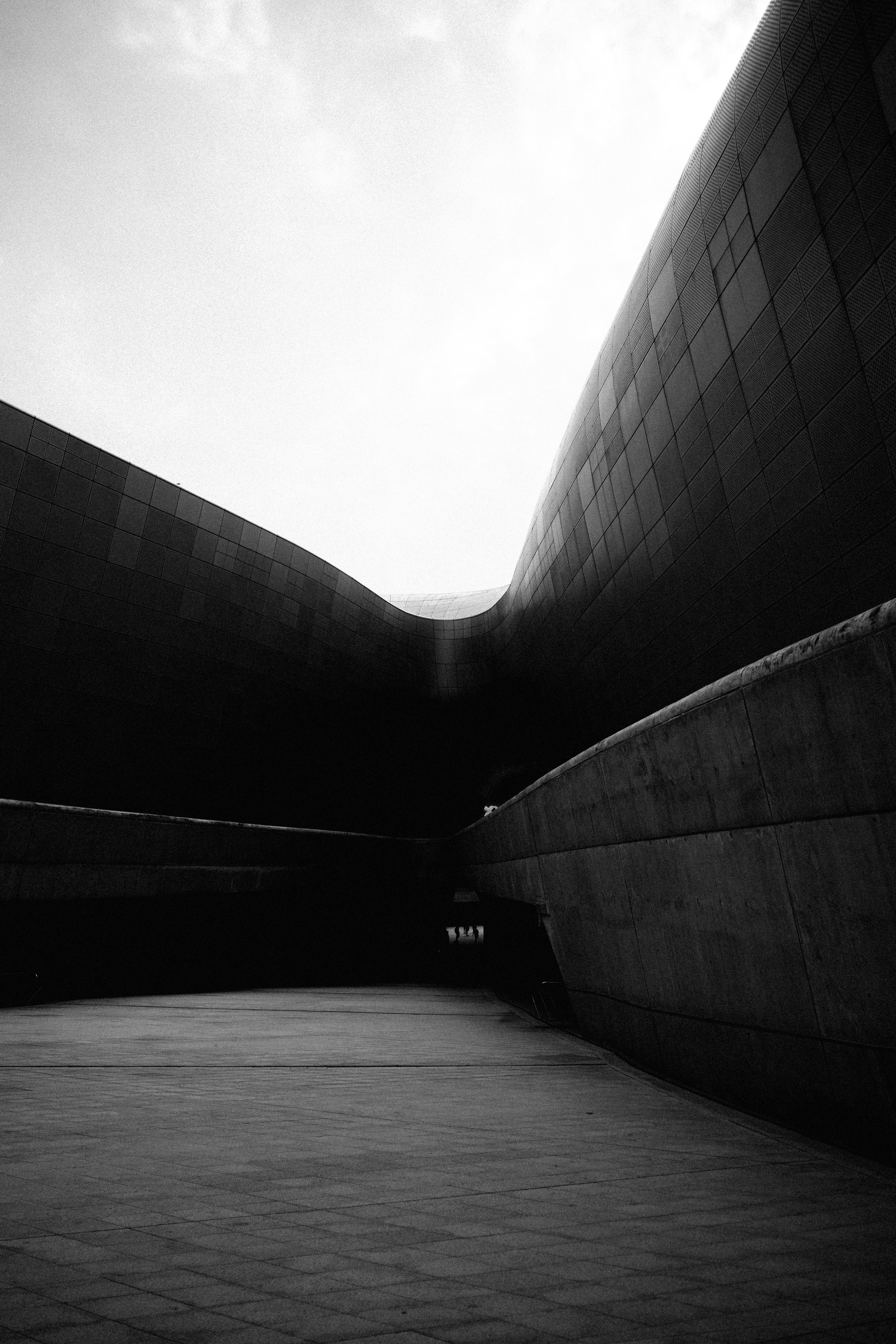 Monolithic Curve: A Descent into Shadowed Architecture