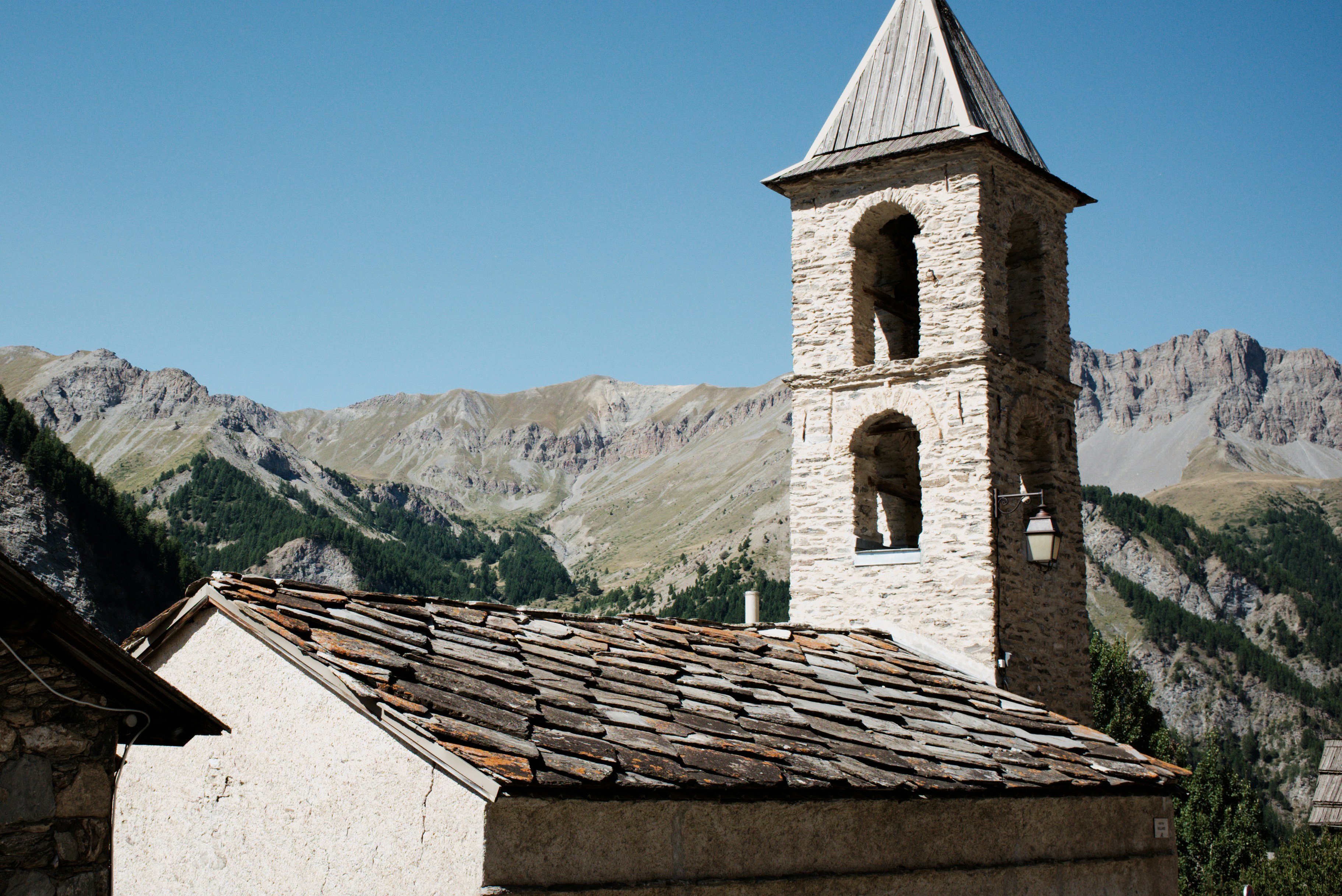 Stone Bell Tower in Alpine Setting