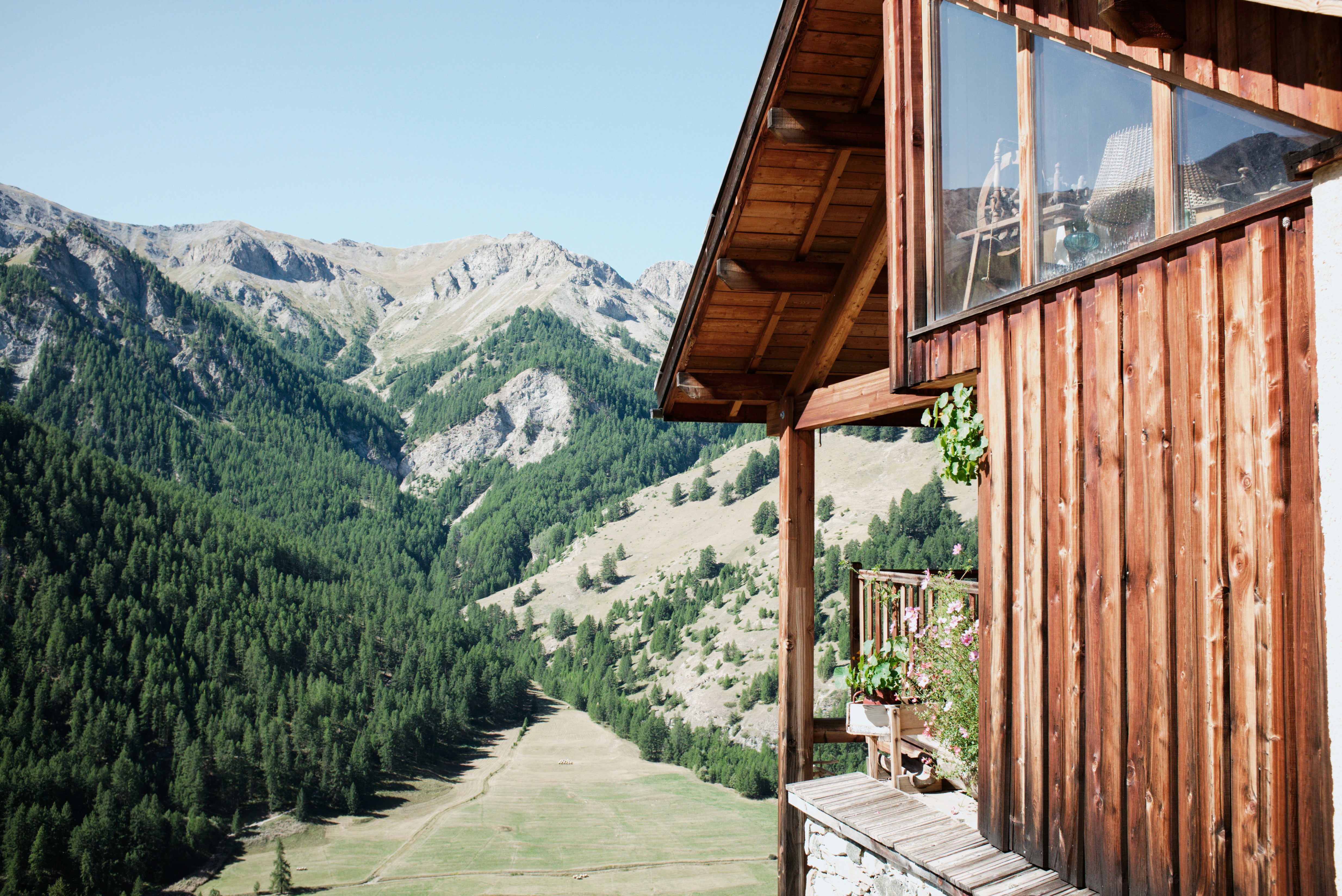 Wooden Chalet Framing a Mountain Valley