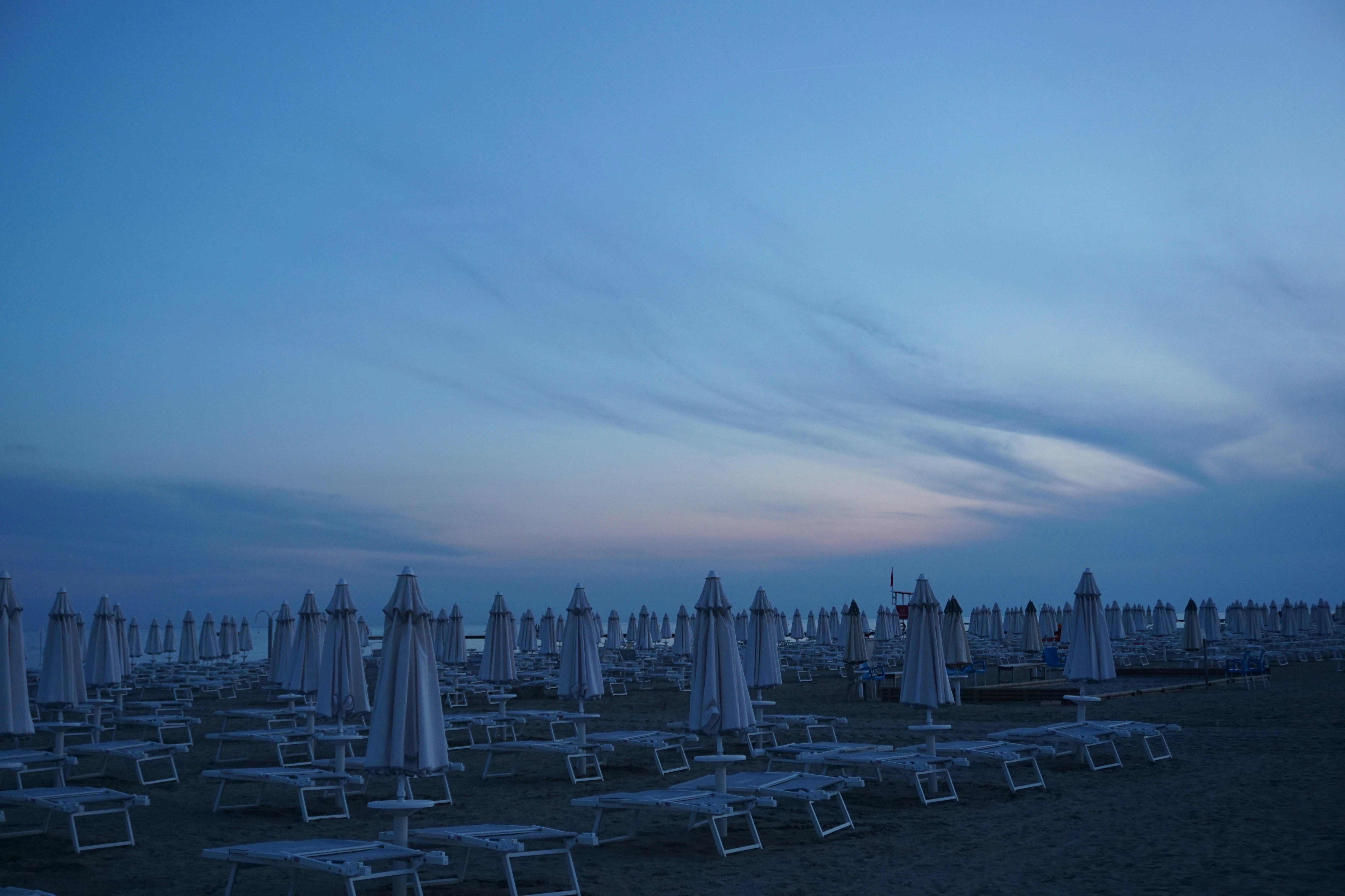 Rows of Silent Umbrellas at Dusk Beach