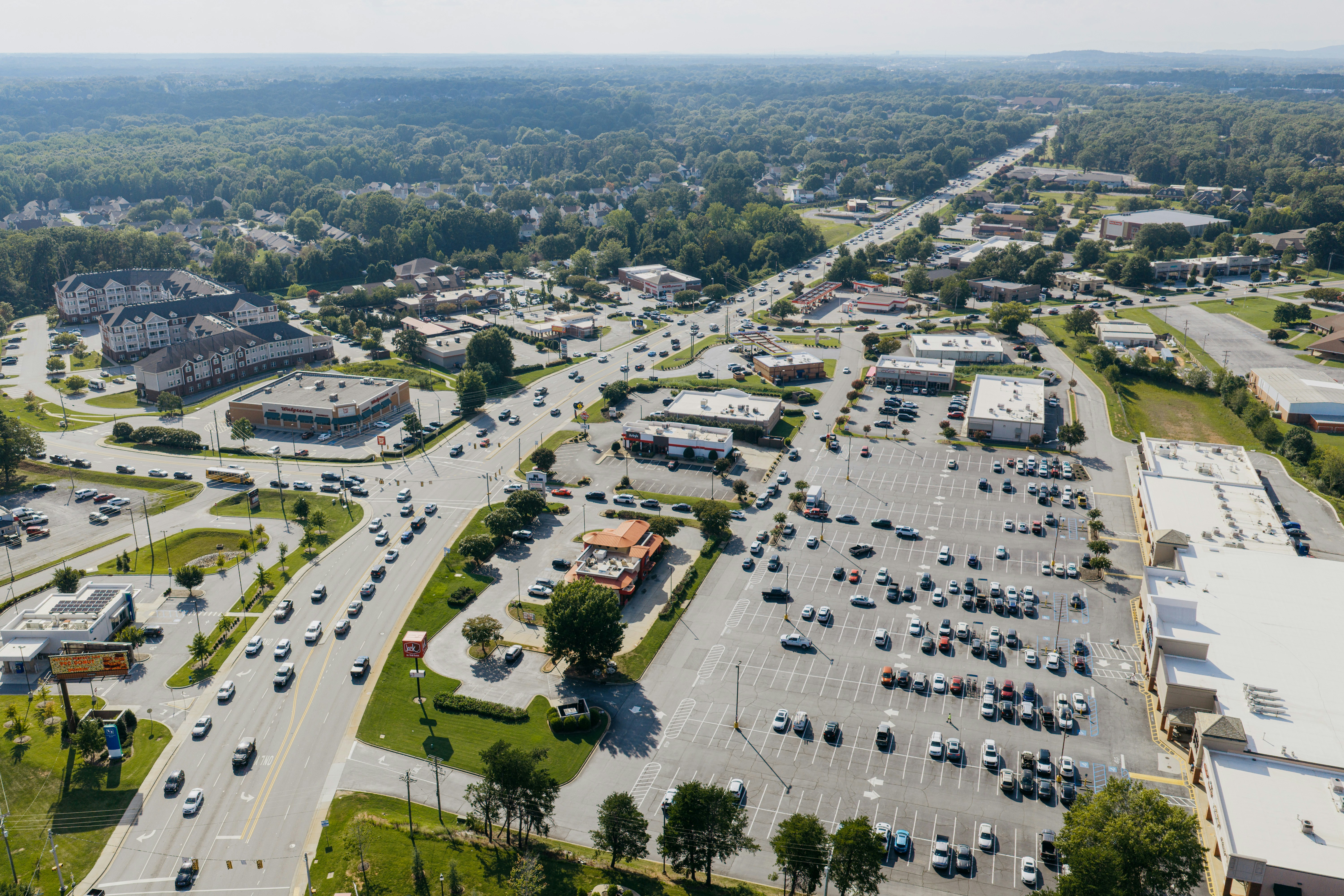 Aerial Grid: Parking Lots, Roads, and Campus Buildings in Suburban Layout