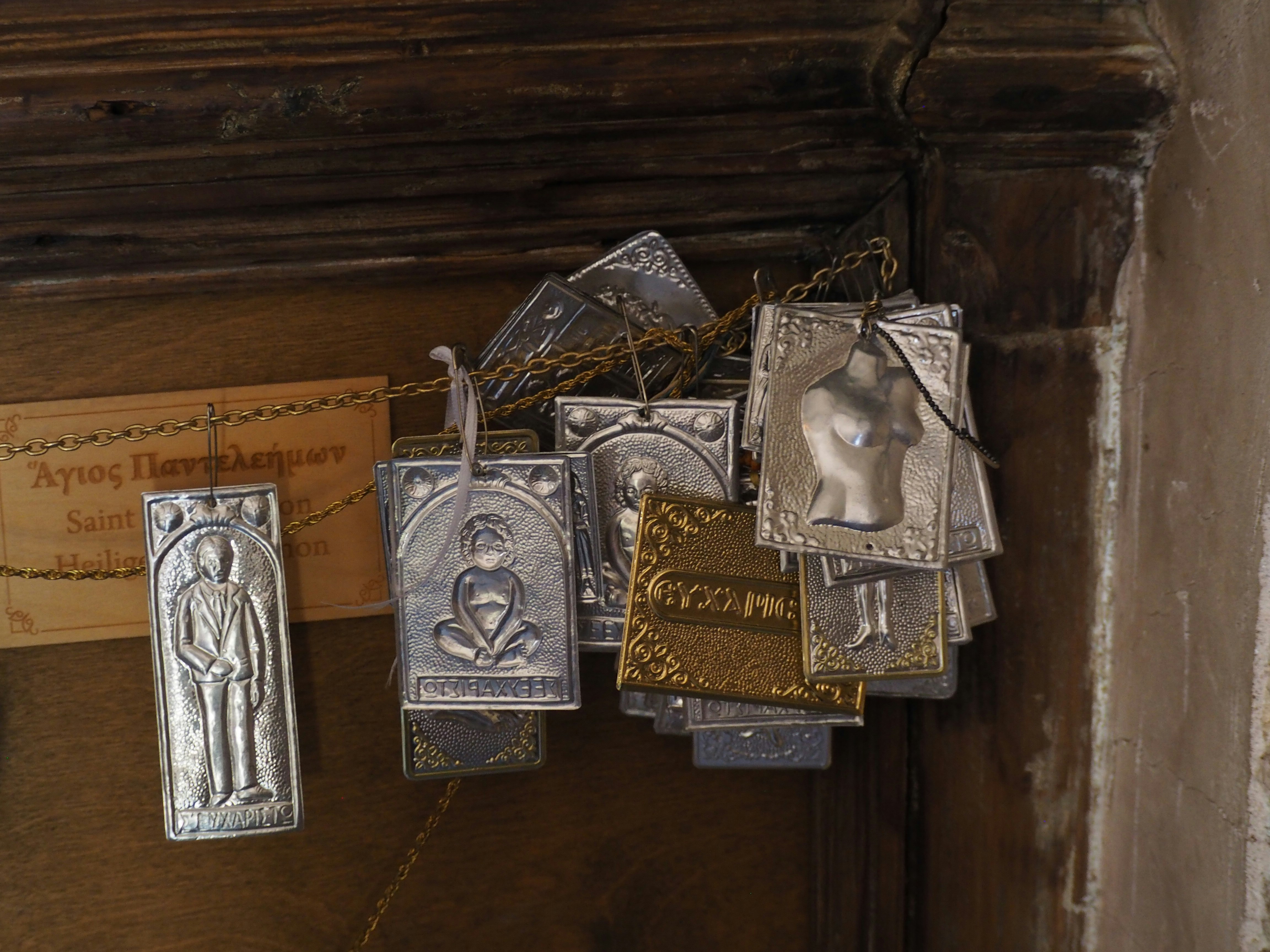 Hangin’ Charms: Silver Icons on a Rustic Board