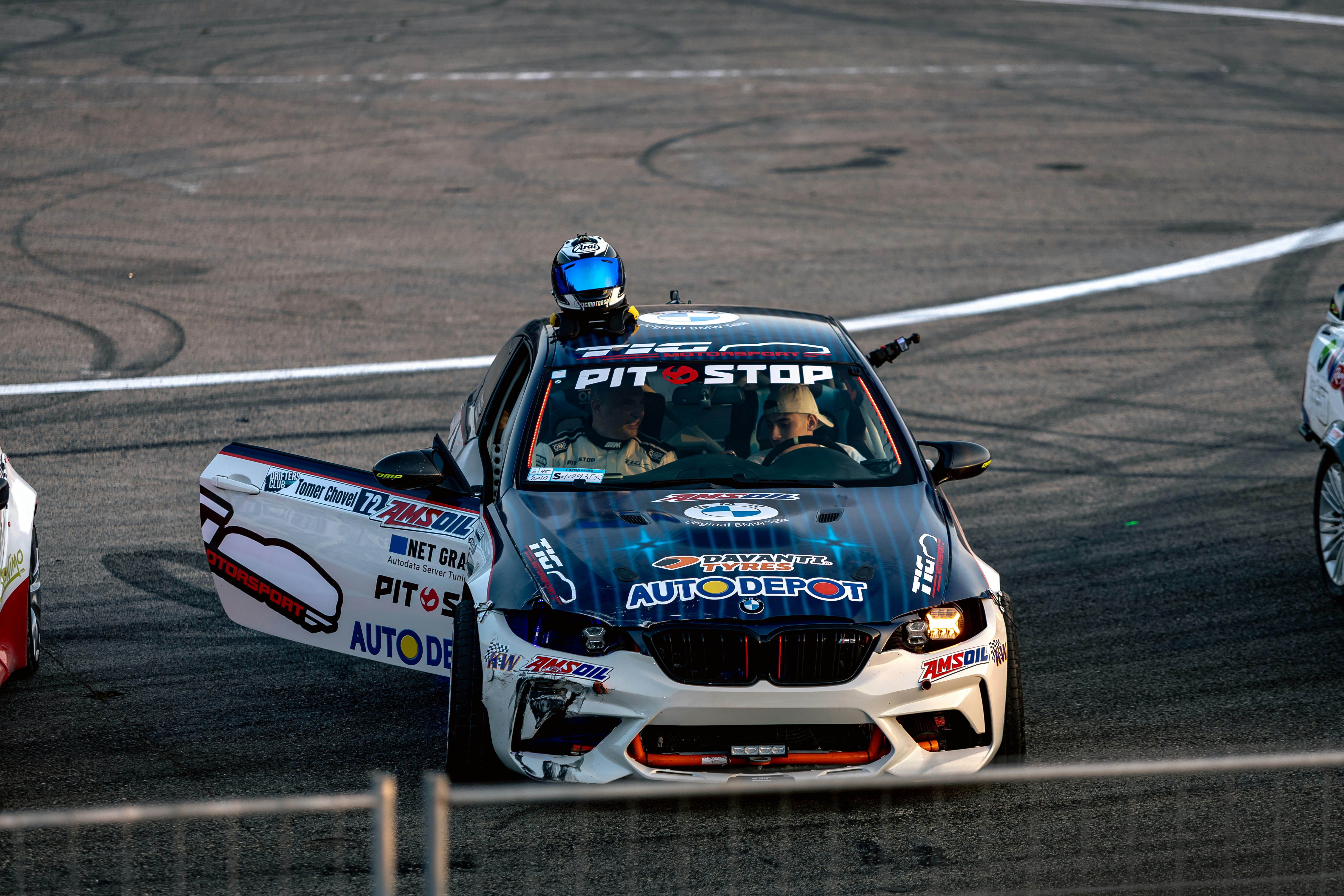 Pit-Stop Pulse: Front-and-Center Racing Car at the Gate