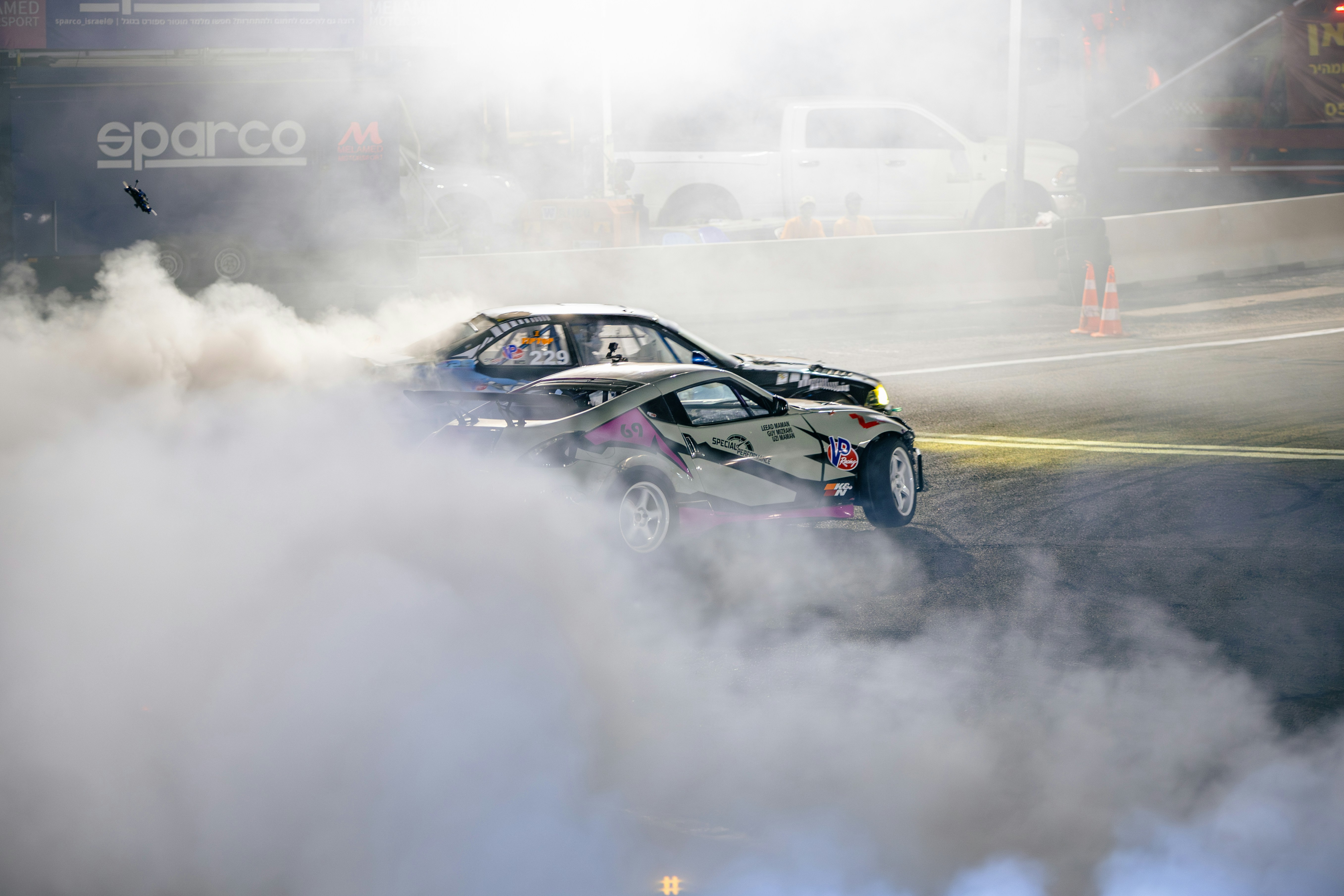 Smoke and Steel: A Drift Duel in Clouded Neon
