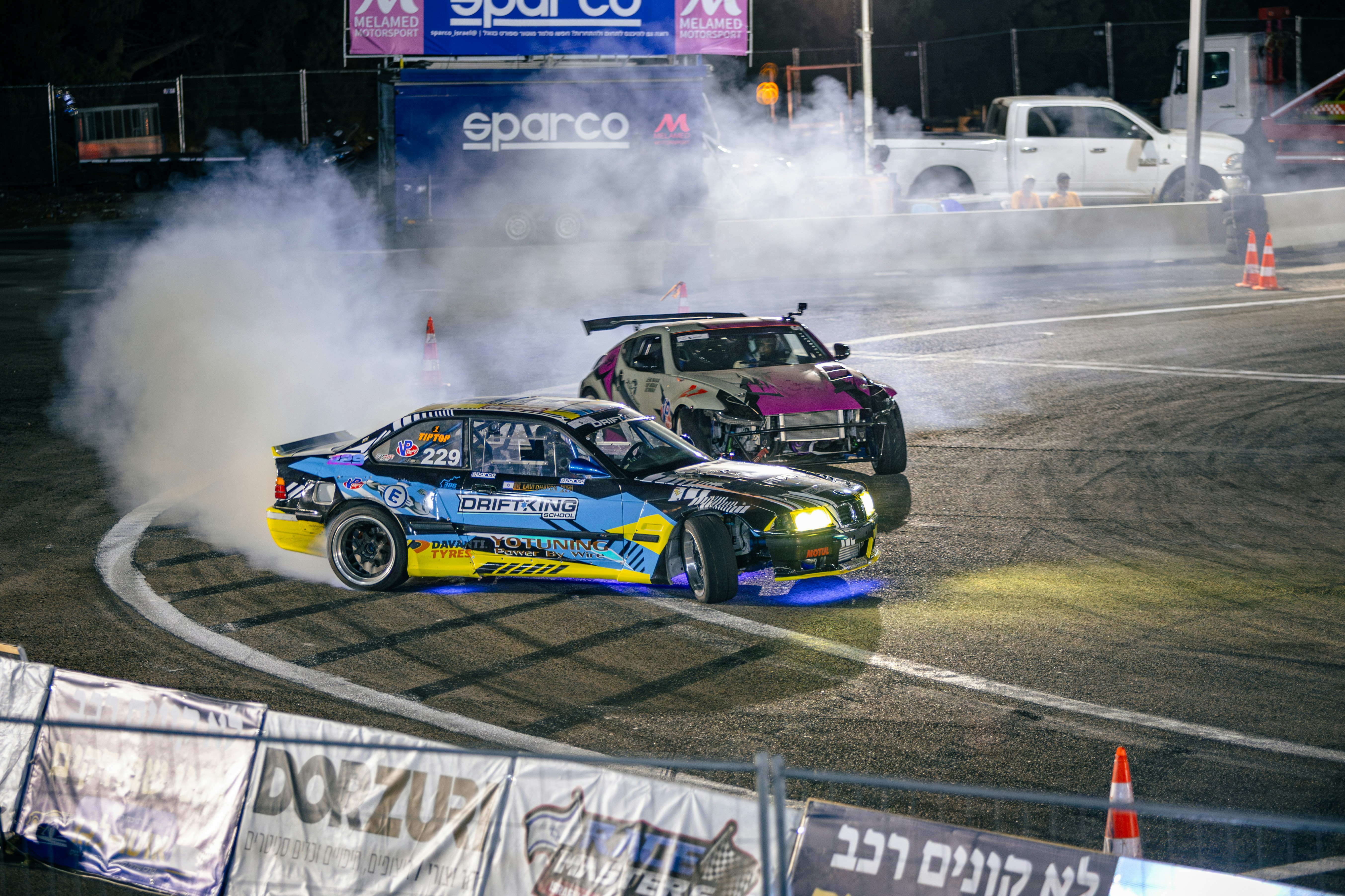 Blue-and-yellow Drift Mastery: Smoke and Speed at the Barricaded Bend