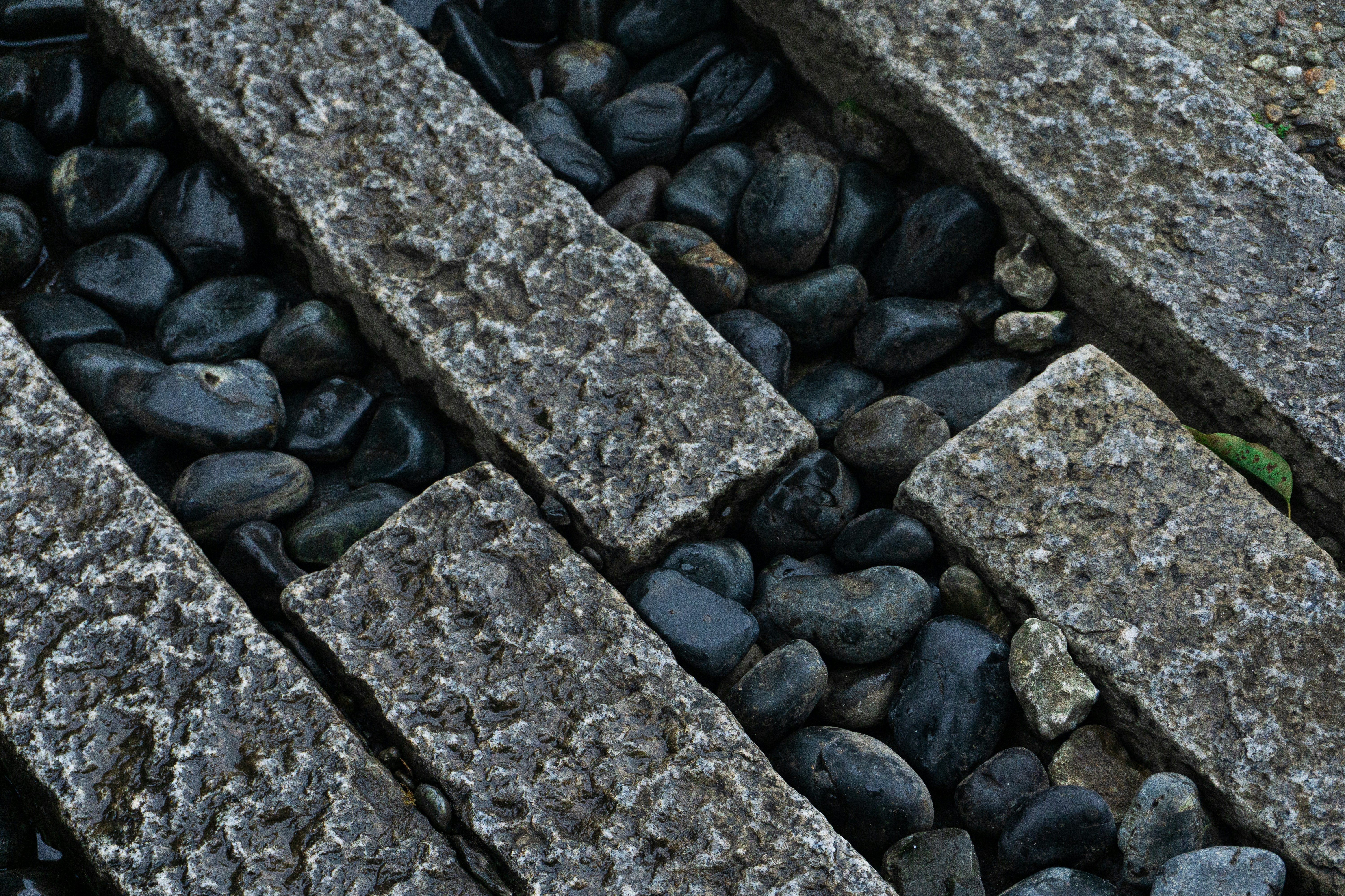 Weathered Concrete Slabs Framing Pebbled Ground