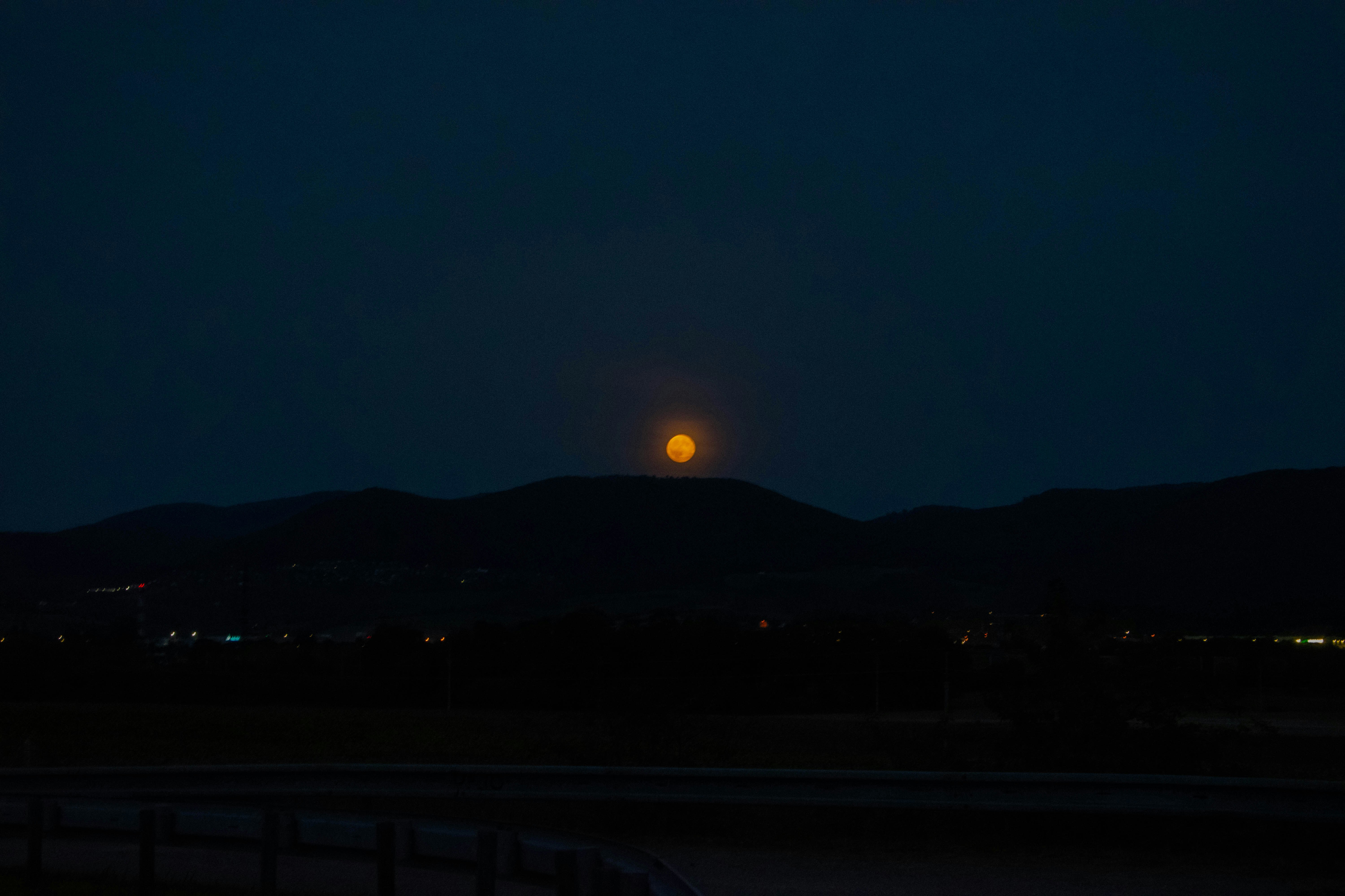 Lone Moonrise Over Quiet Hills