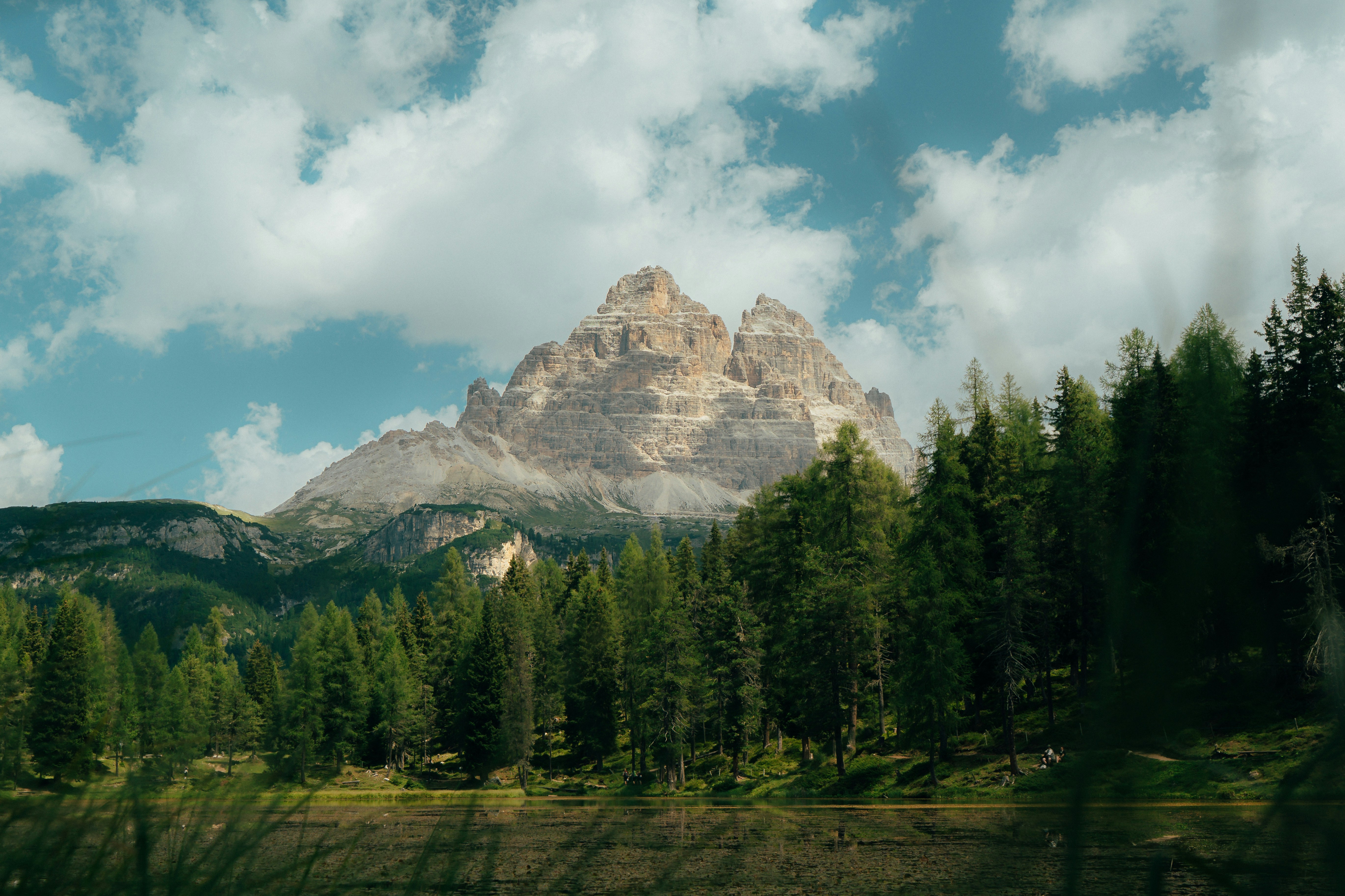 Twin-Peaked Summit Rising Above a Pine-Fringed Lake
