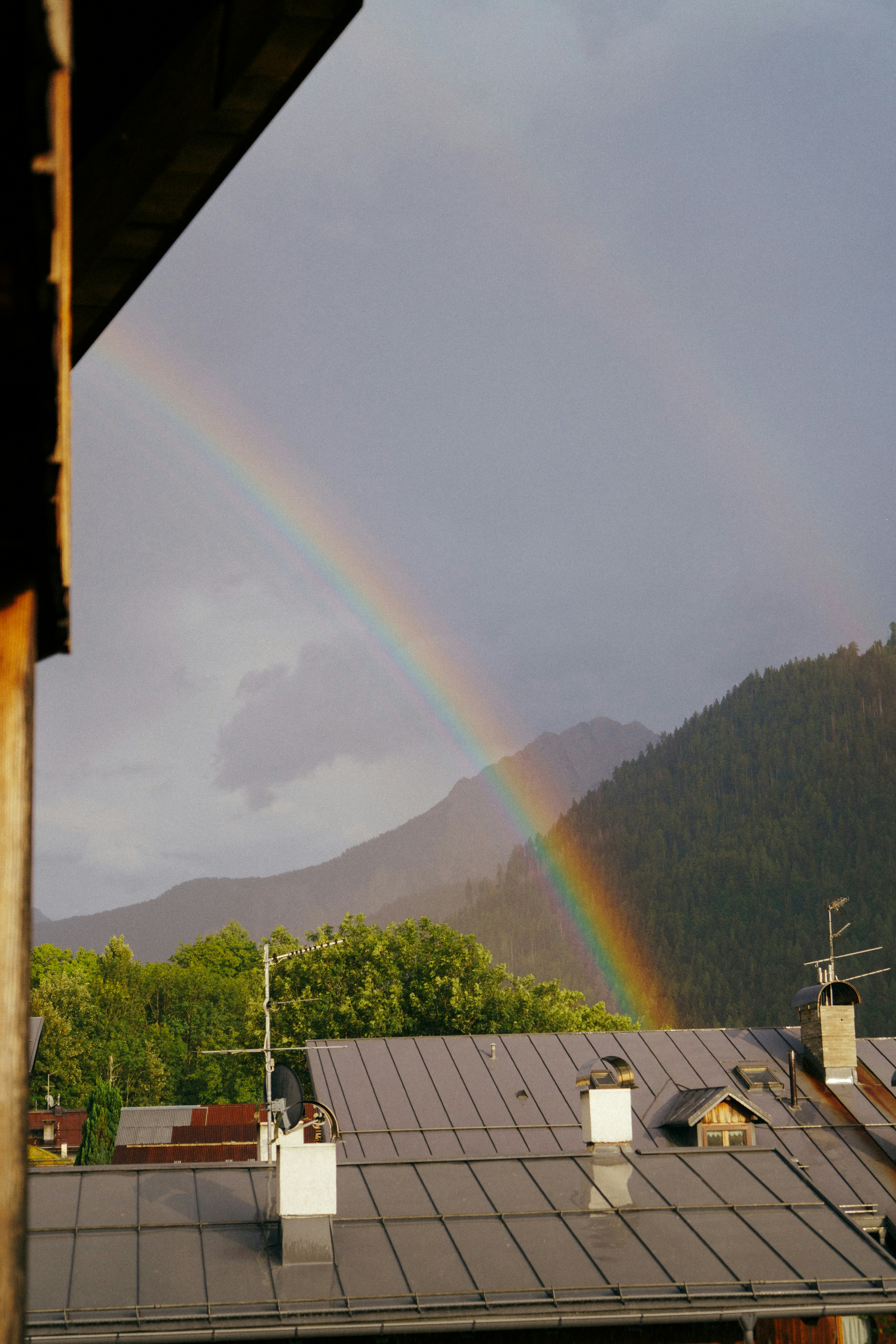 Rainbow Over Rooftops: A Quiet Valley Evening