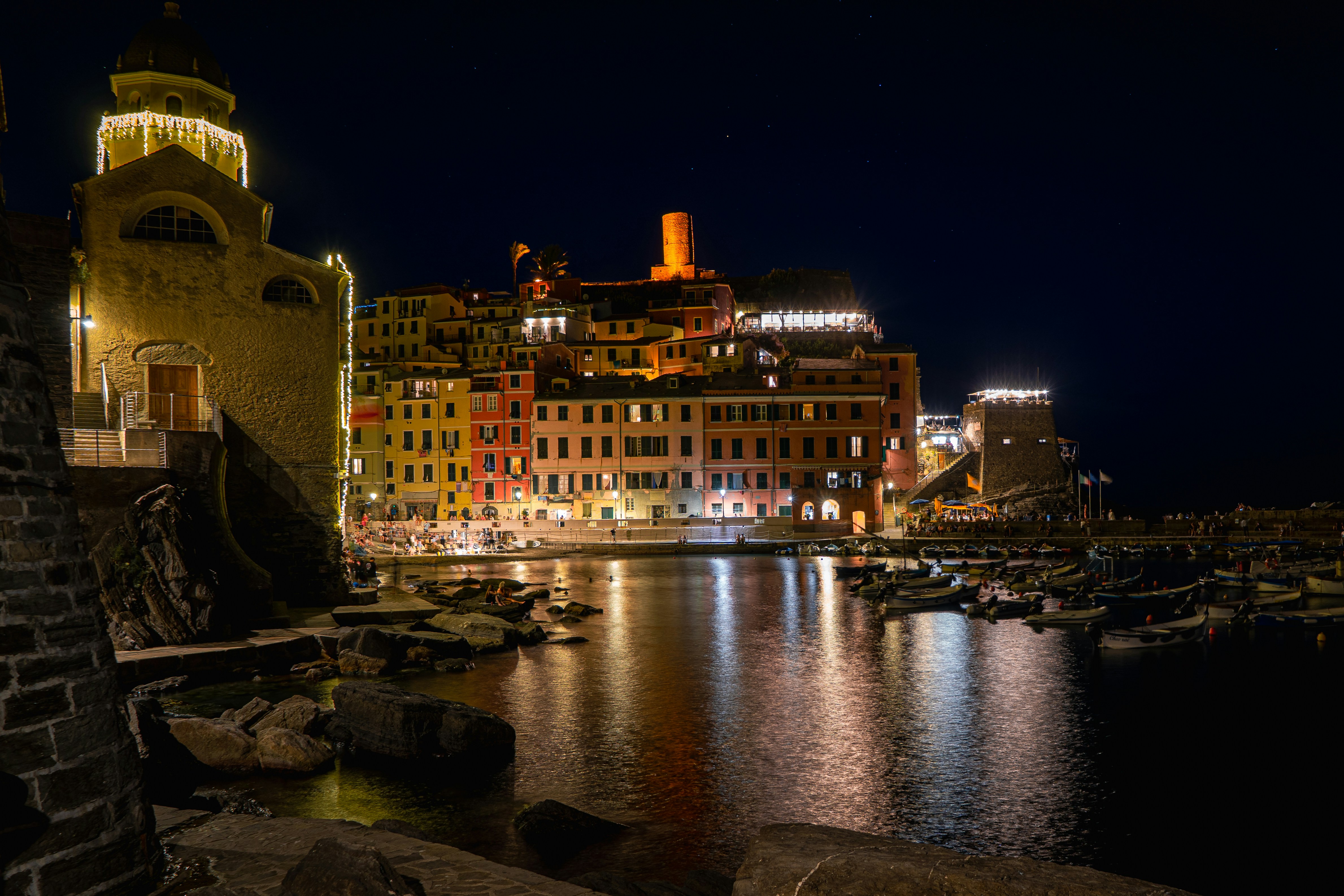 Moonlit Fondazione: Nighttime Fishing Village Reaches for the Harbor Lights