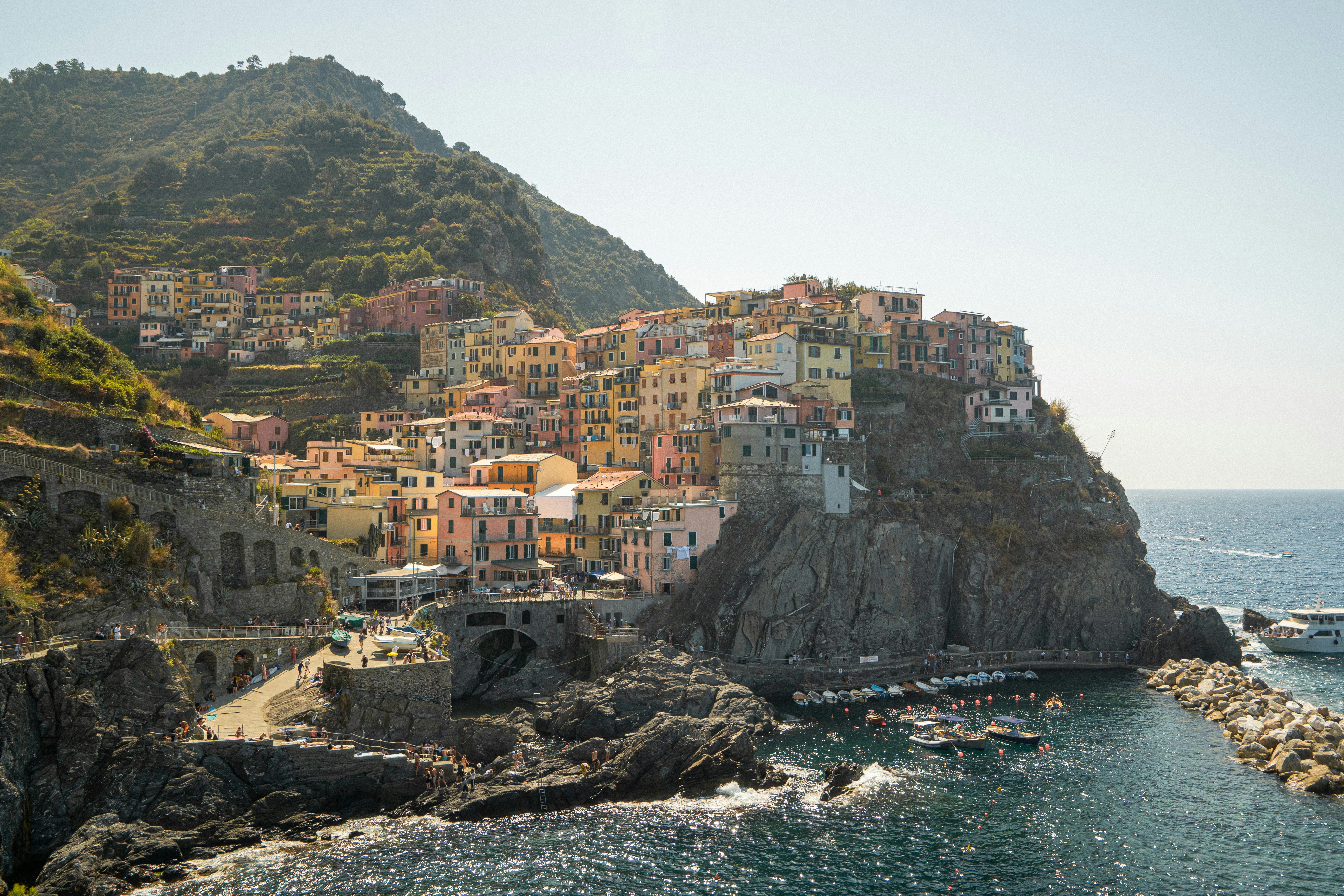Colorful cliffside village tucked into Ligurian rocks at the sea edge