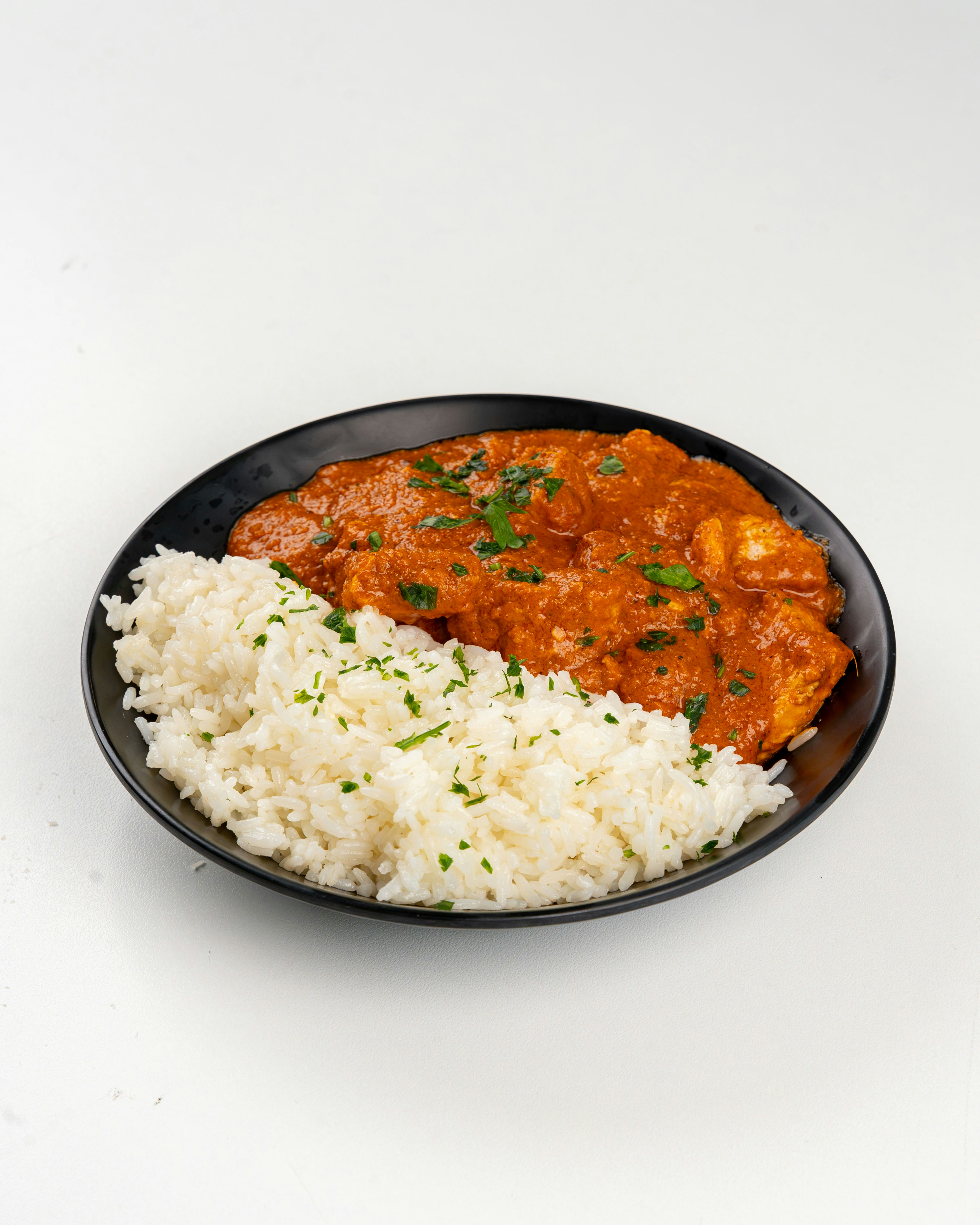 Creamy Rice and Tomato-Cathed Curry in a Minimalist Bowl