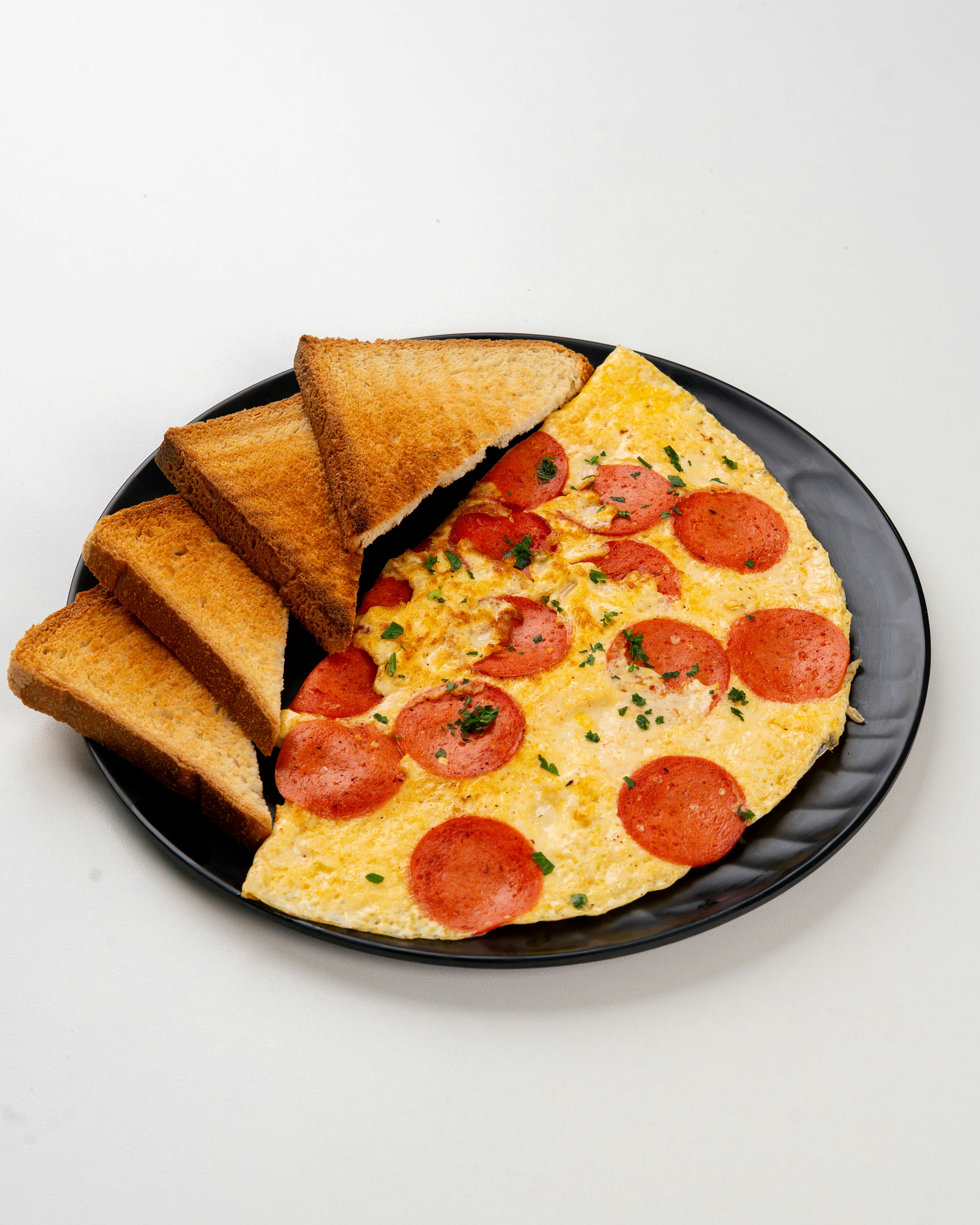 Pepperoni Sunset on a Black Plate
