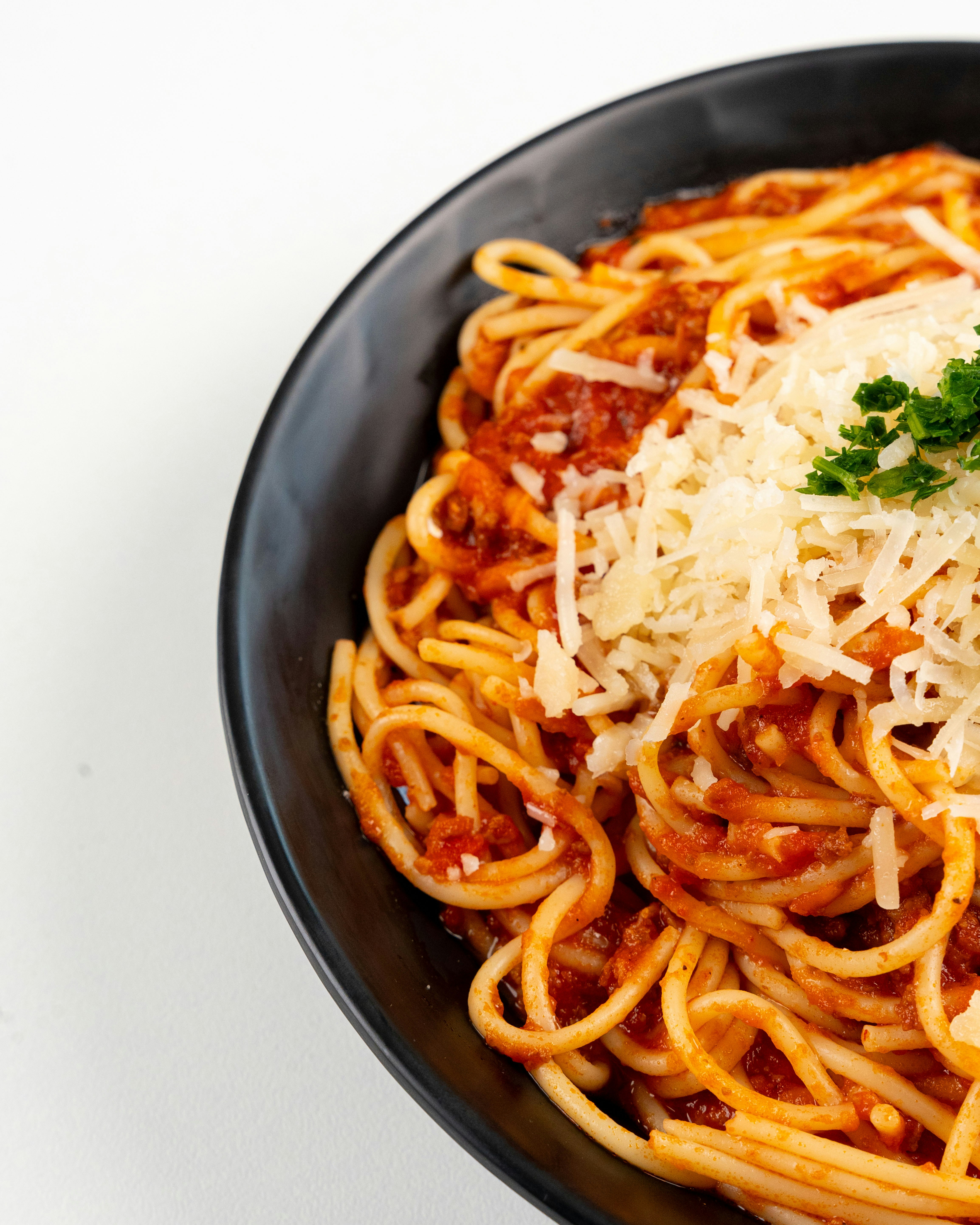Plate of Cozy Tomato-Spiced Spaghetti with Fresh Parmesan