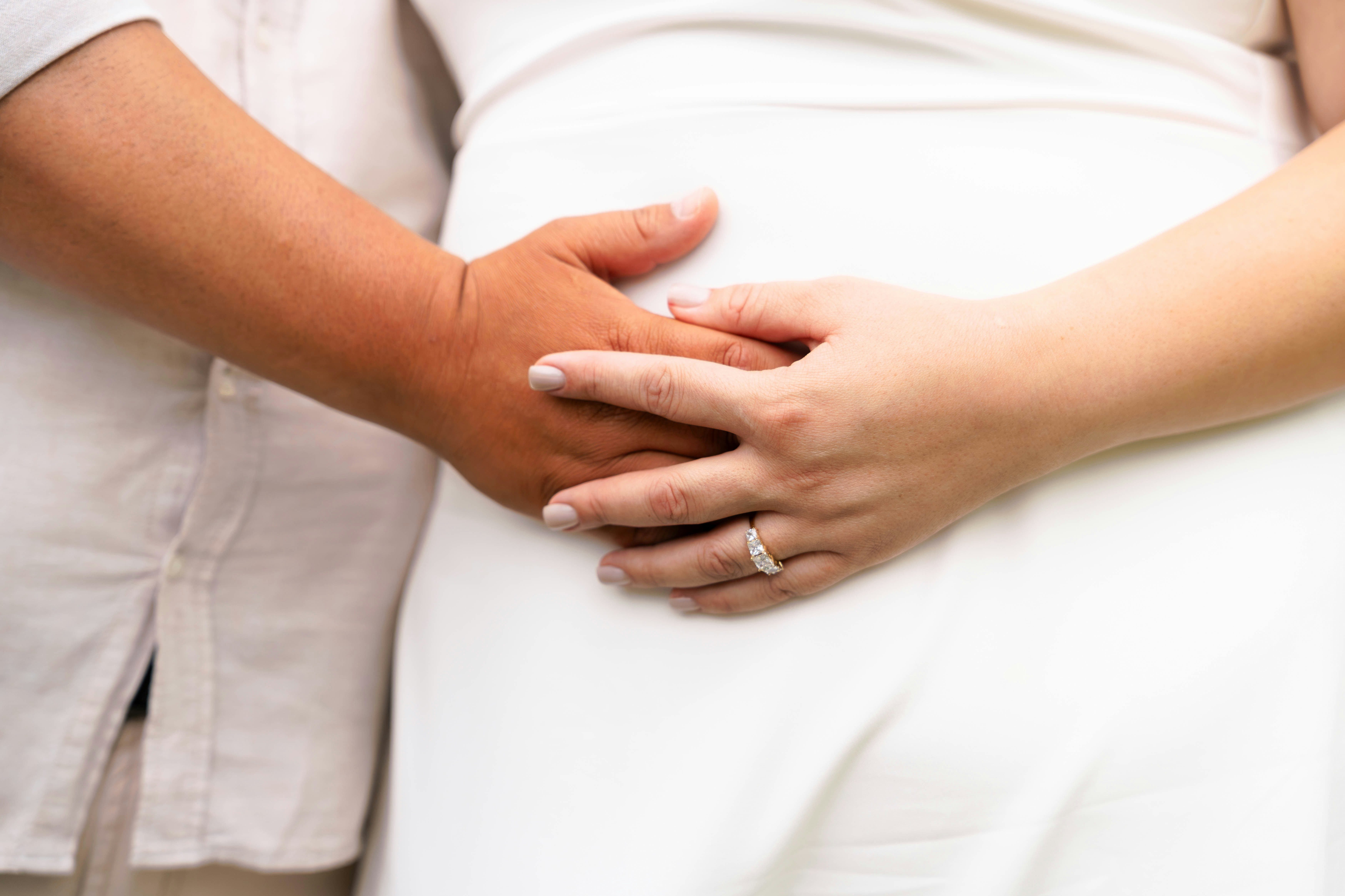 Hands of Joy: A Tender Moment Framing a New Beginning