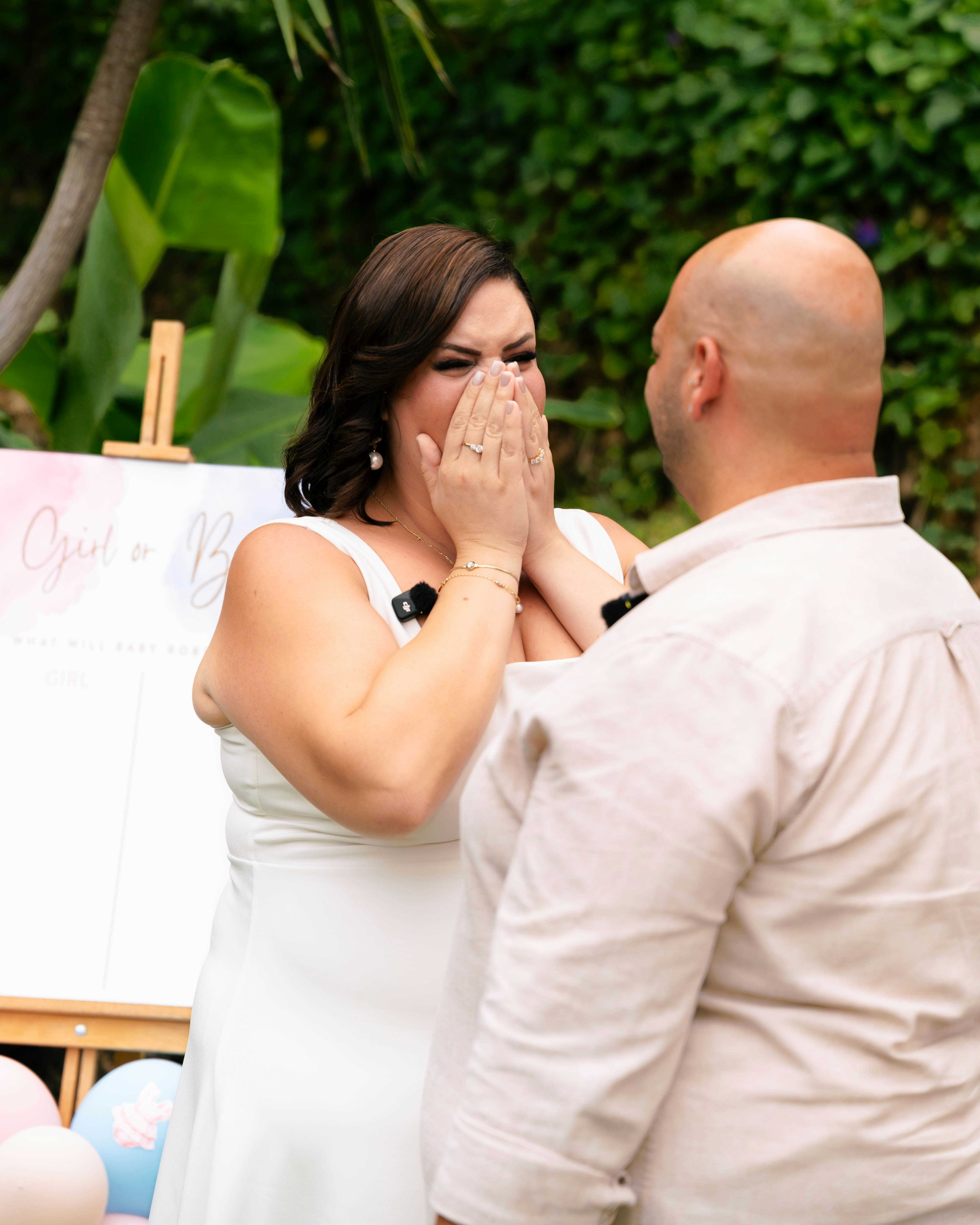Surprise and Joy: A Bride's Hushed Reaction in a Garden Moment