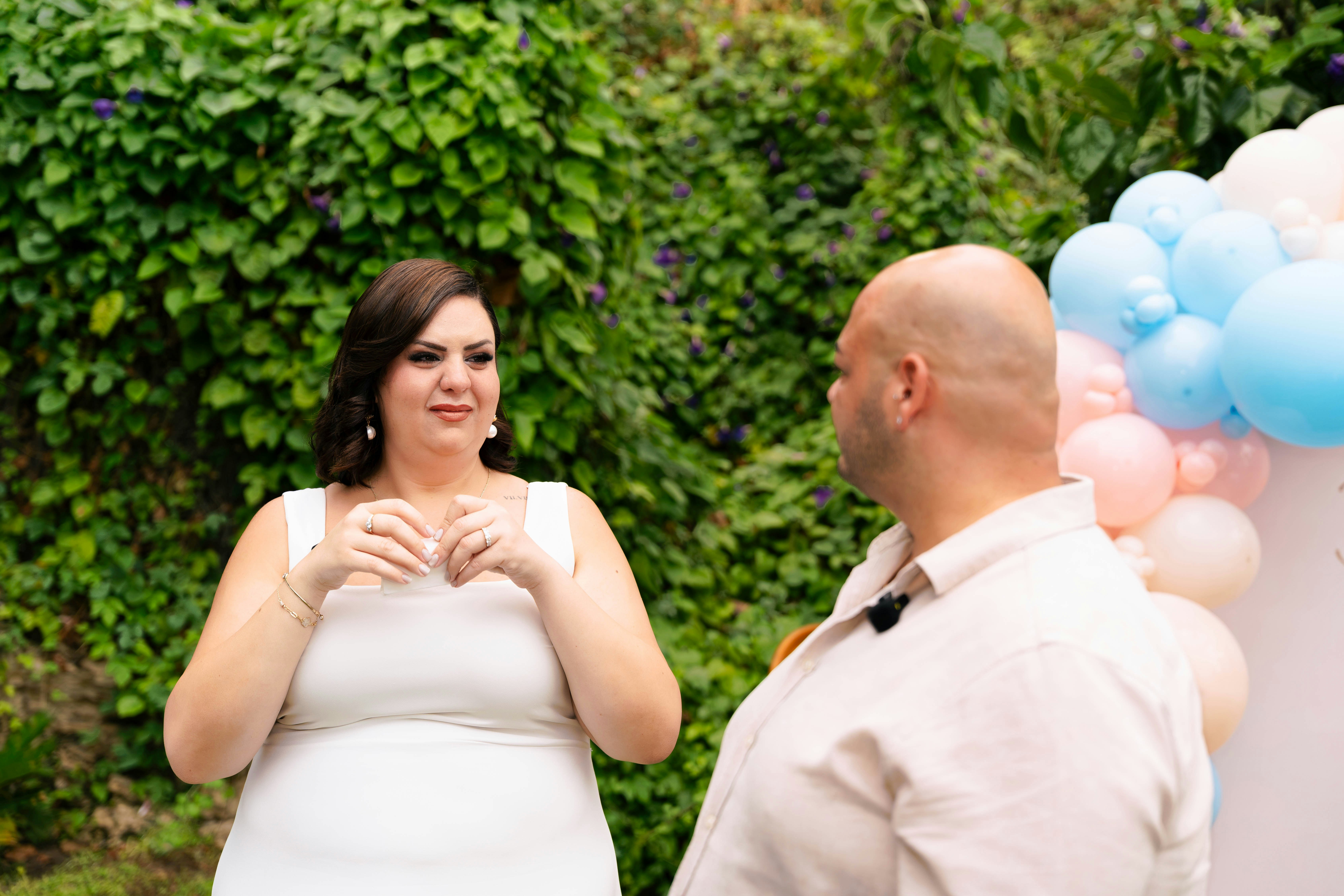 Bride-to-be in a Moment of Quiet Joy Amid Balloon Backdrop