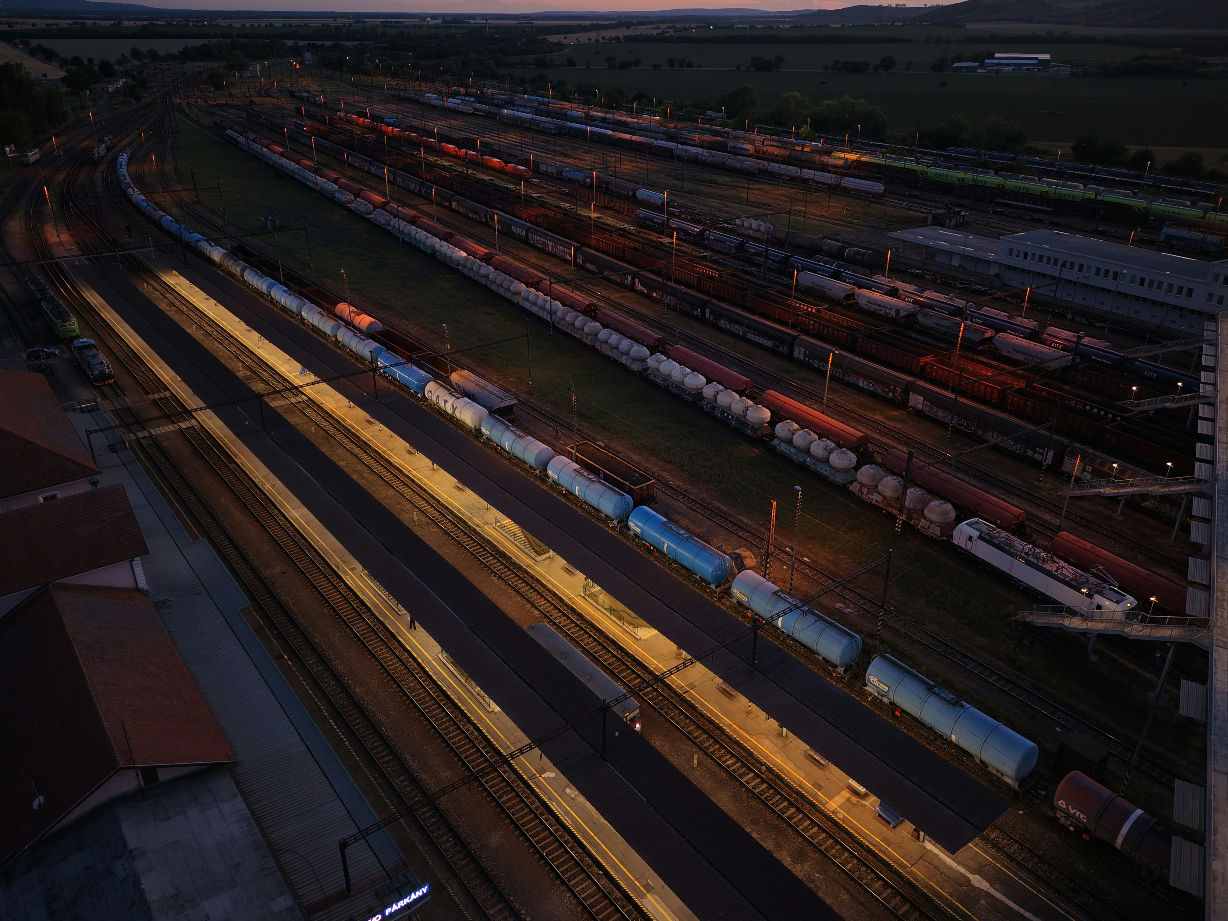 Evening Silhouette Over a Serpentine Freight Yard