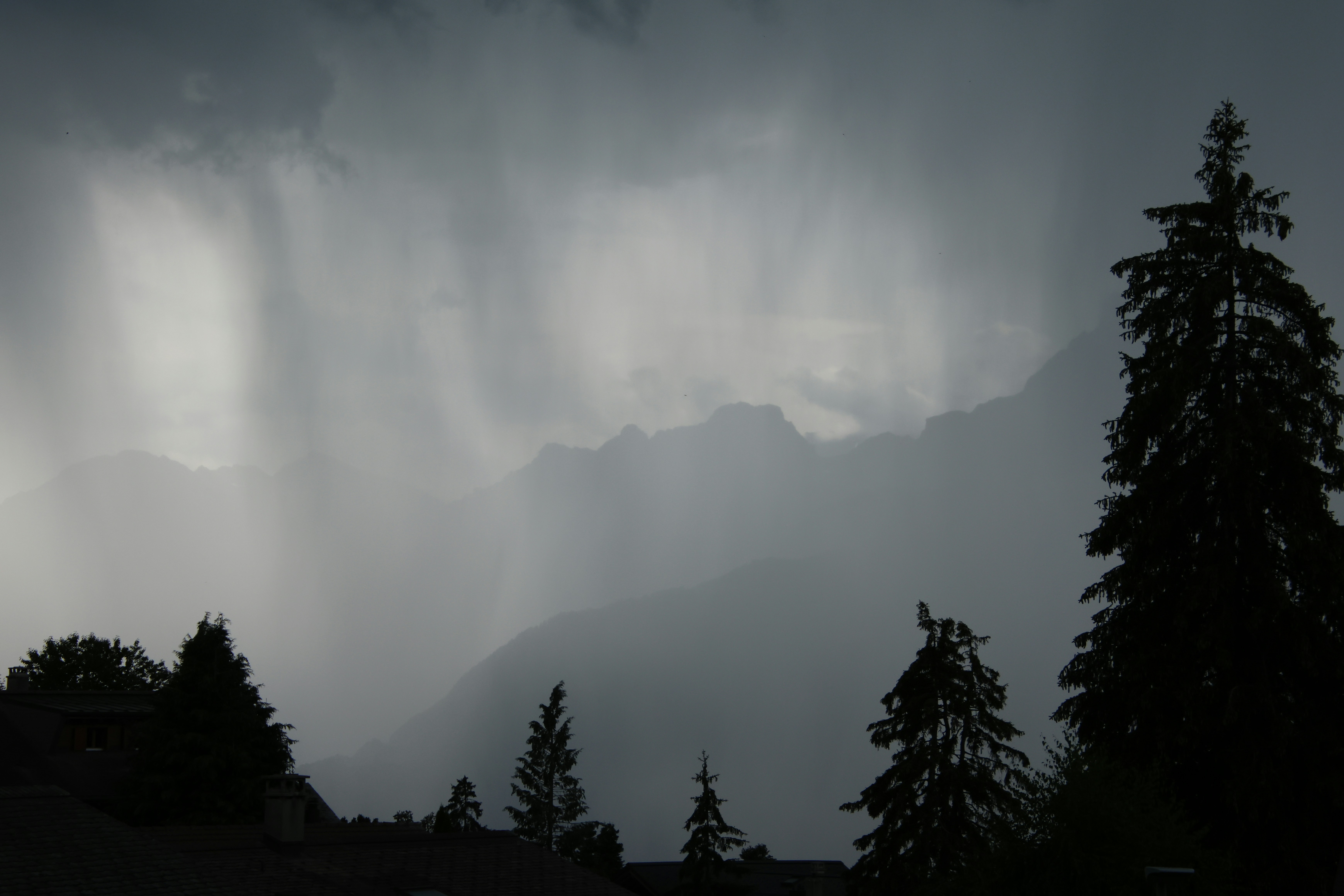 Shadowed Peaks Beneath a Velvet Rain