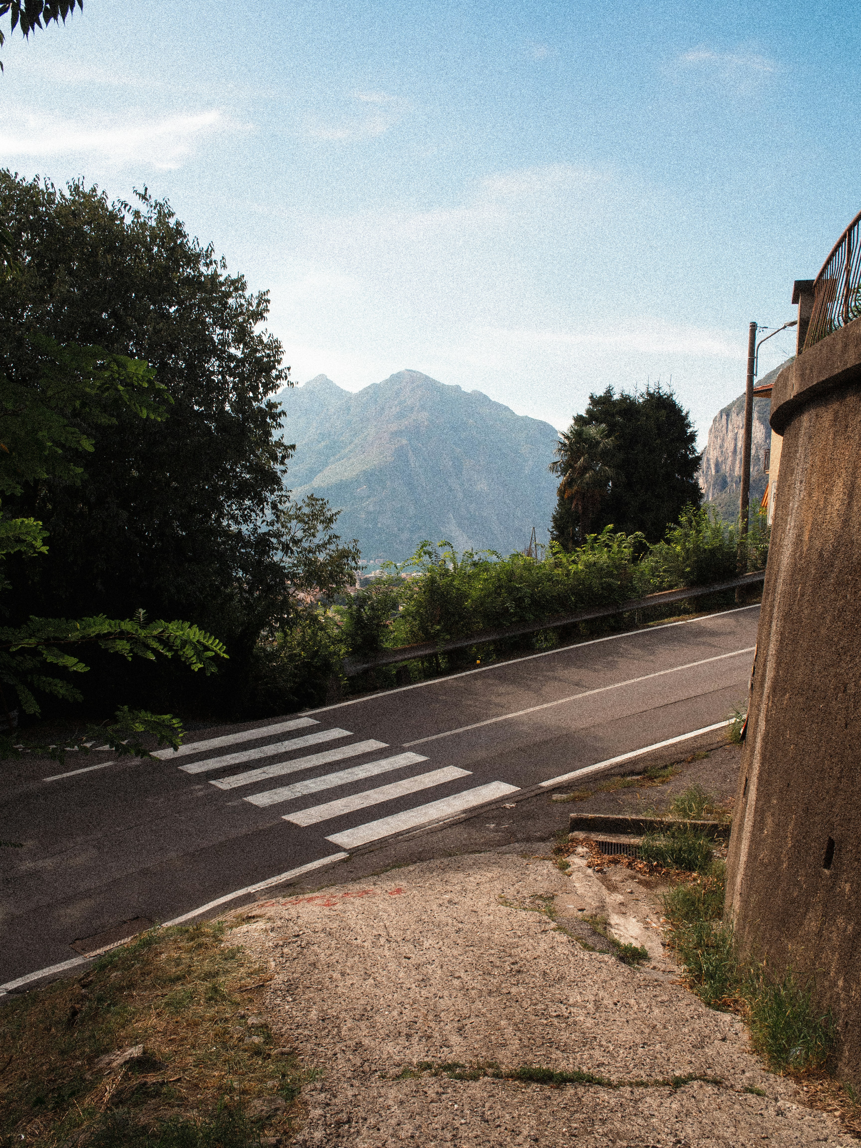 Ridge Road with Crosswalk and Mountain Backdrop