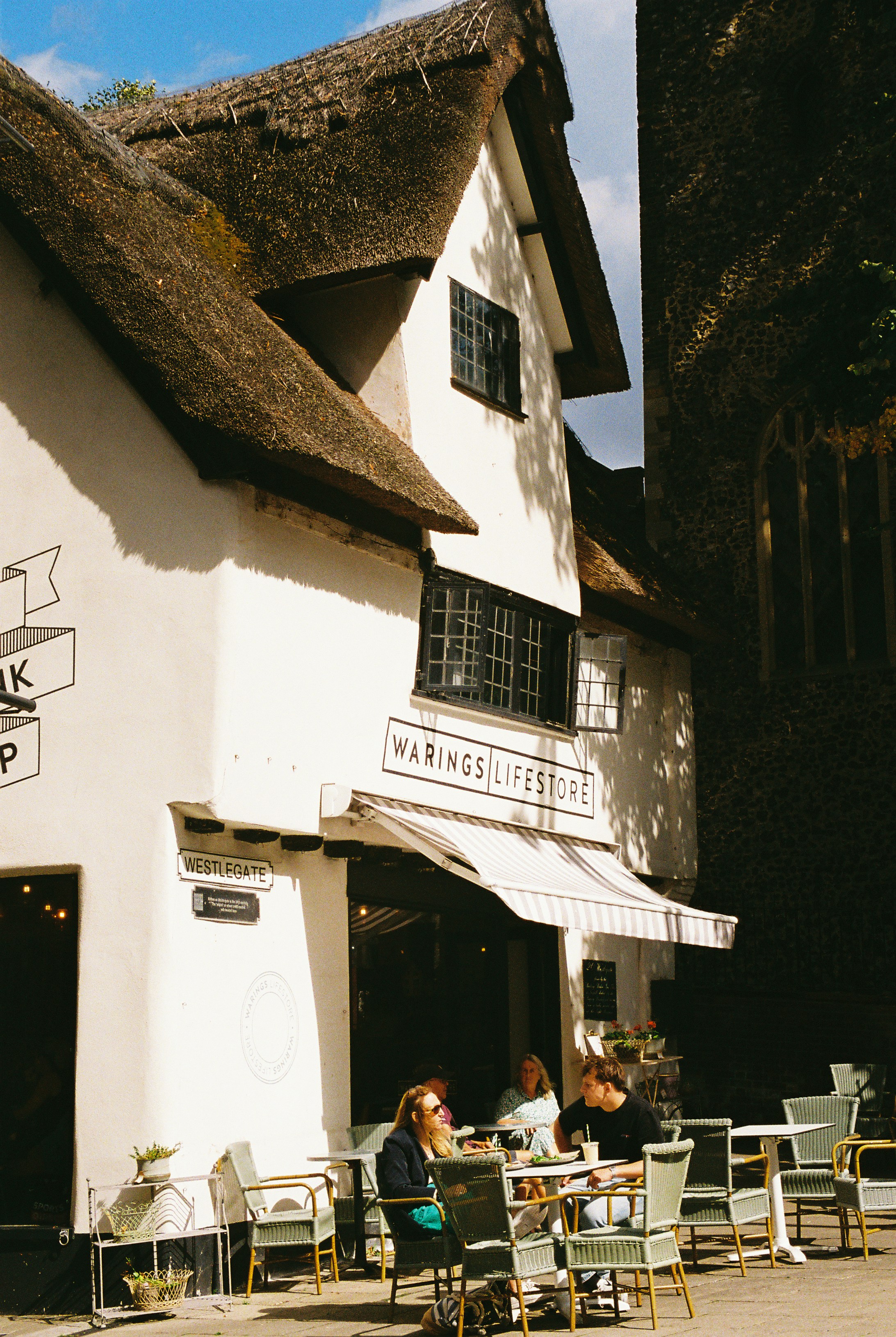 Cafe Terrace at Shady Peak: A Sunlit Morning in Warings Lane