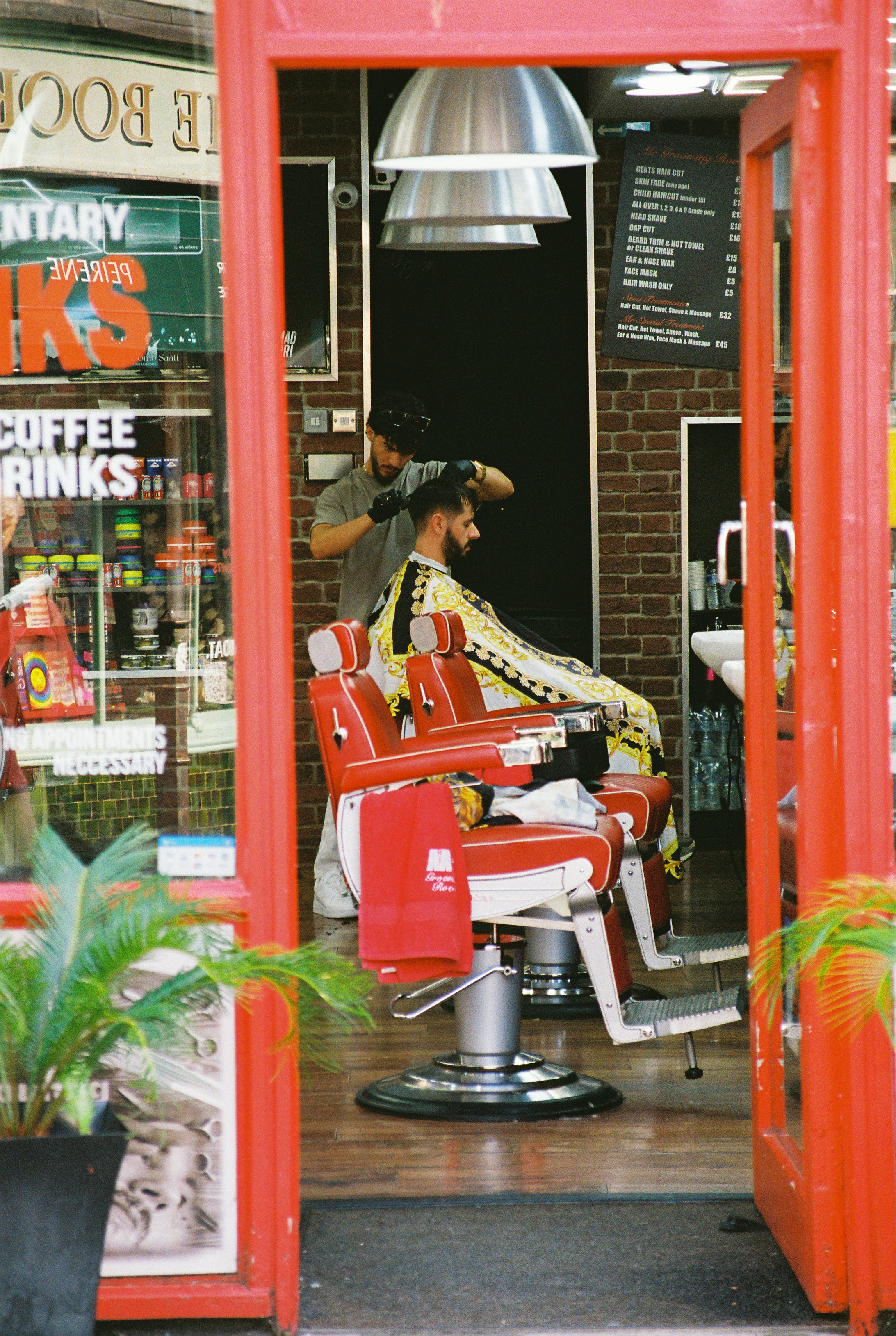 Barbershop Portrait in Red-Framed Window Frame