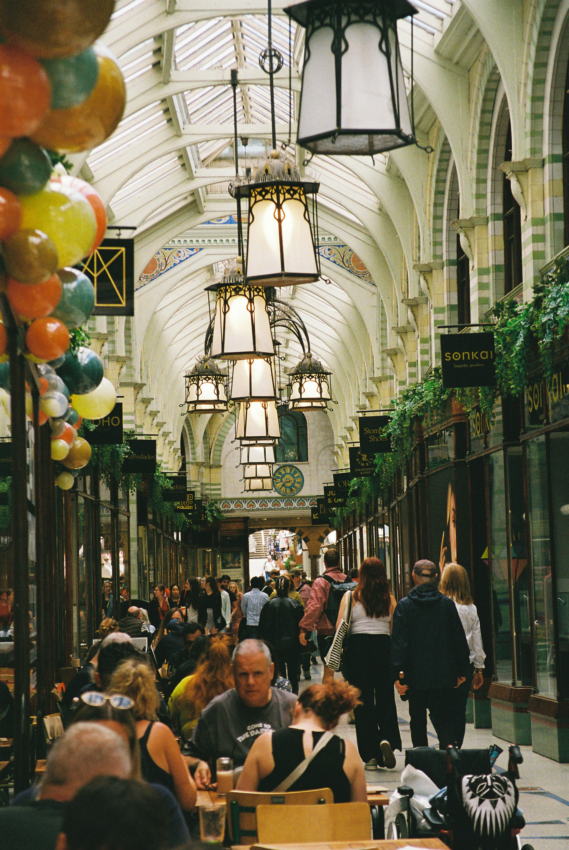 Through the Glass Aisle: Lanterns and An Ever-Changing Crowd