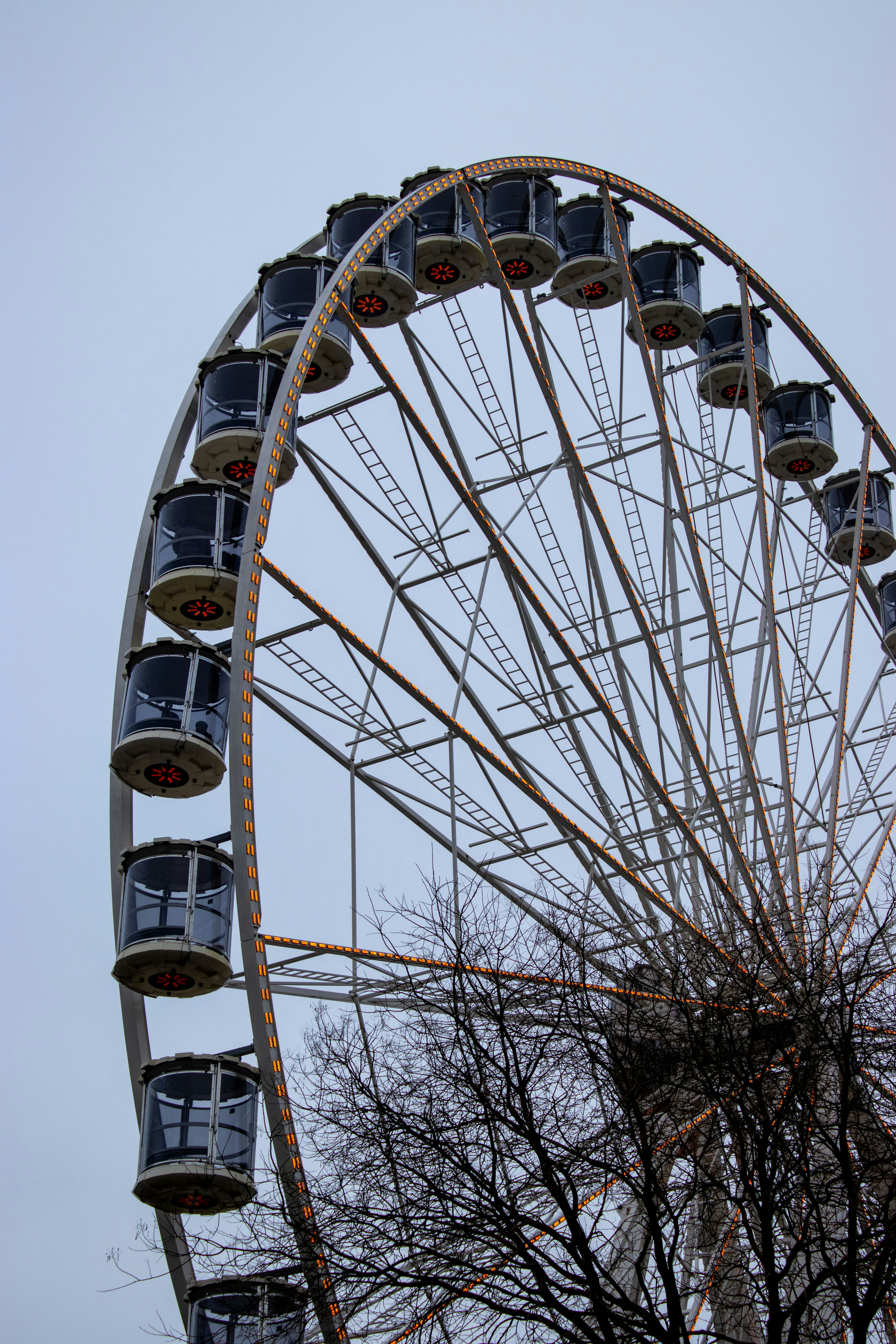 Wheel of Lantern Light: A Partial Ferris Wheel Against a Clear Sky