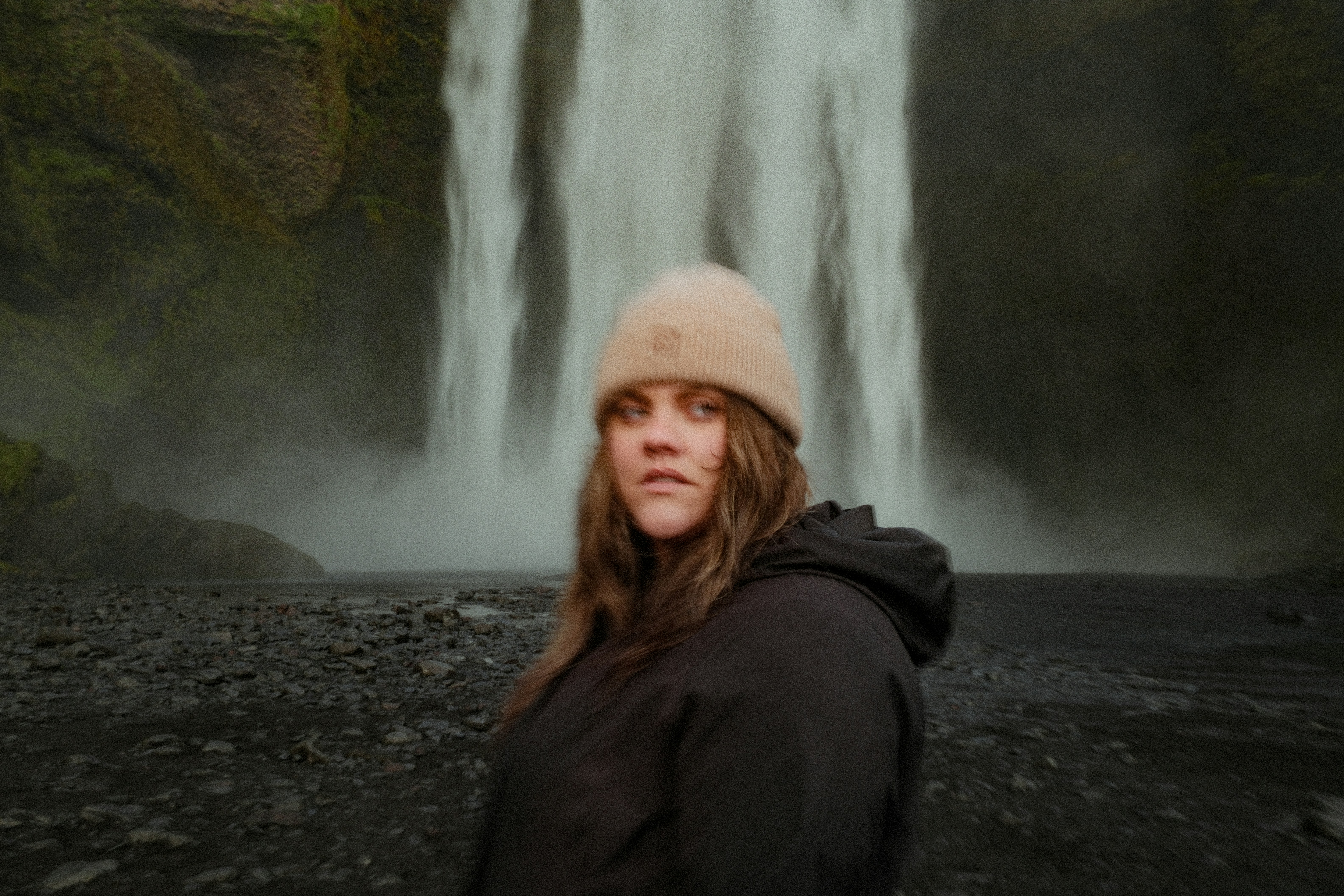Mist and Moment: Portrait in the Shadow of a Waterfall