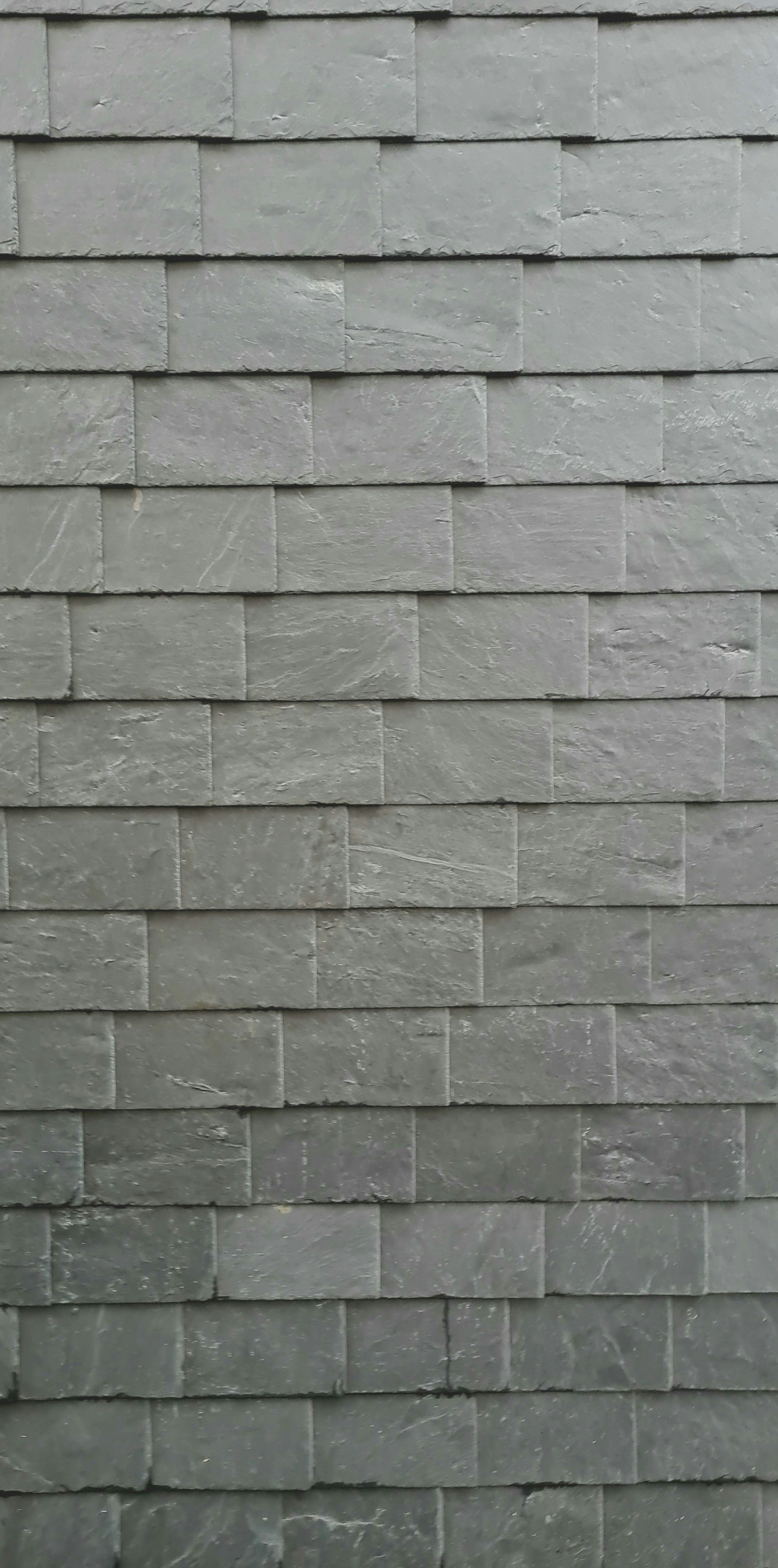 Layered Slate Facade: A Quiet Rhythm of Rectangles