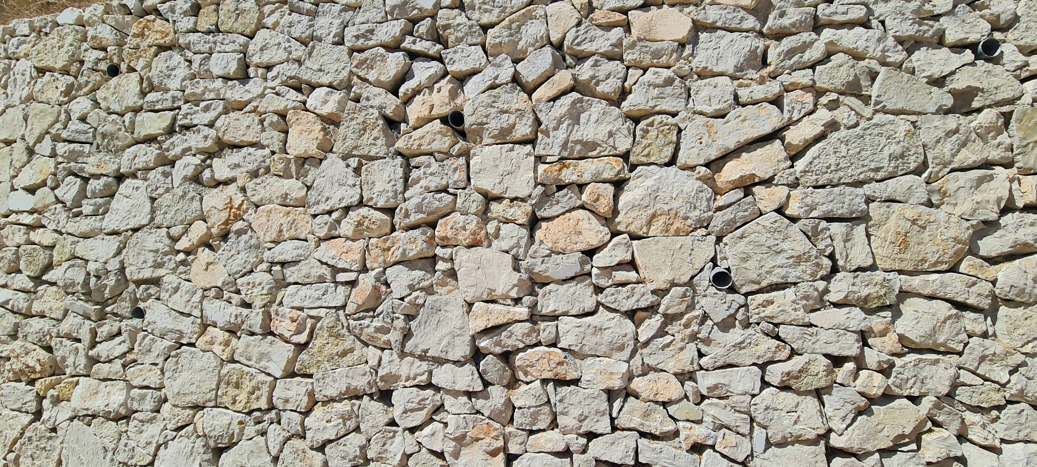 Stone Mosaic Across Quiet Wall