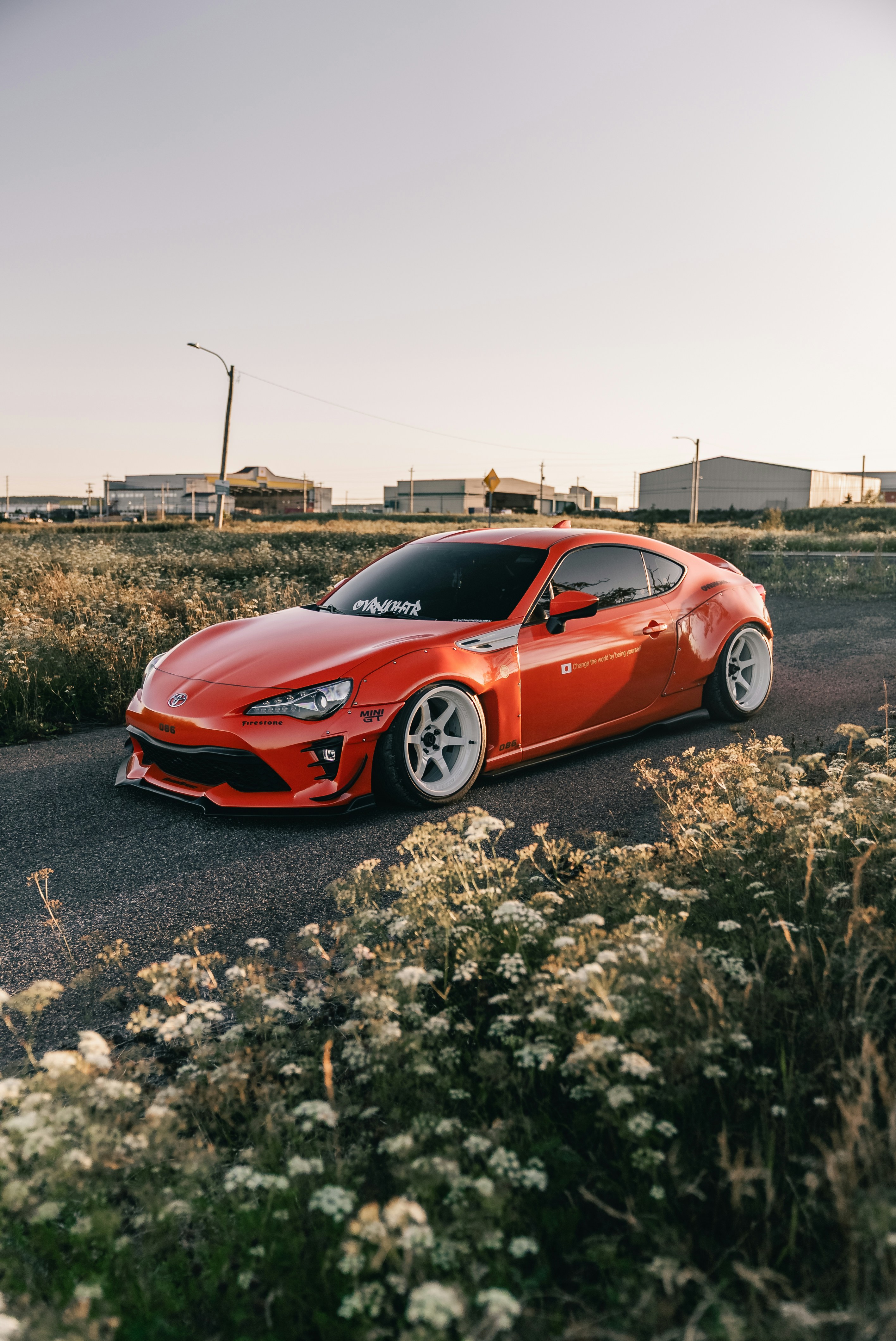 Crimson Drift: A Low-Sun Portrait of a Red Toyota 86 in Wildflower Drift