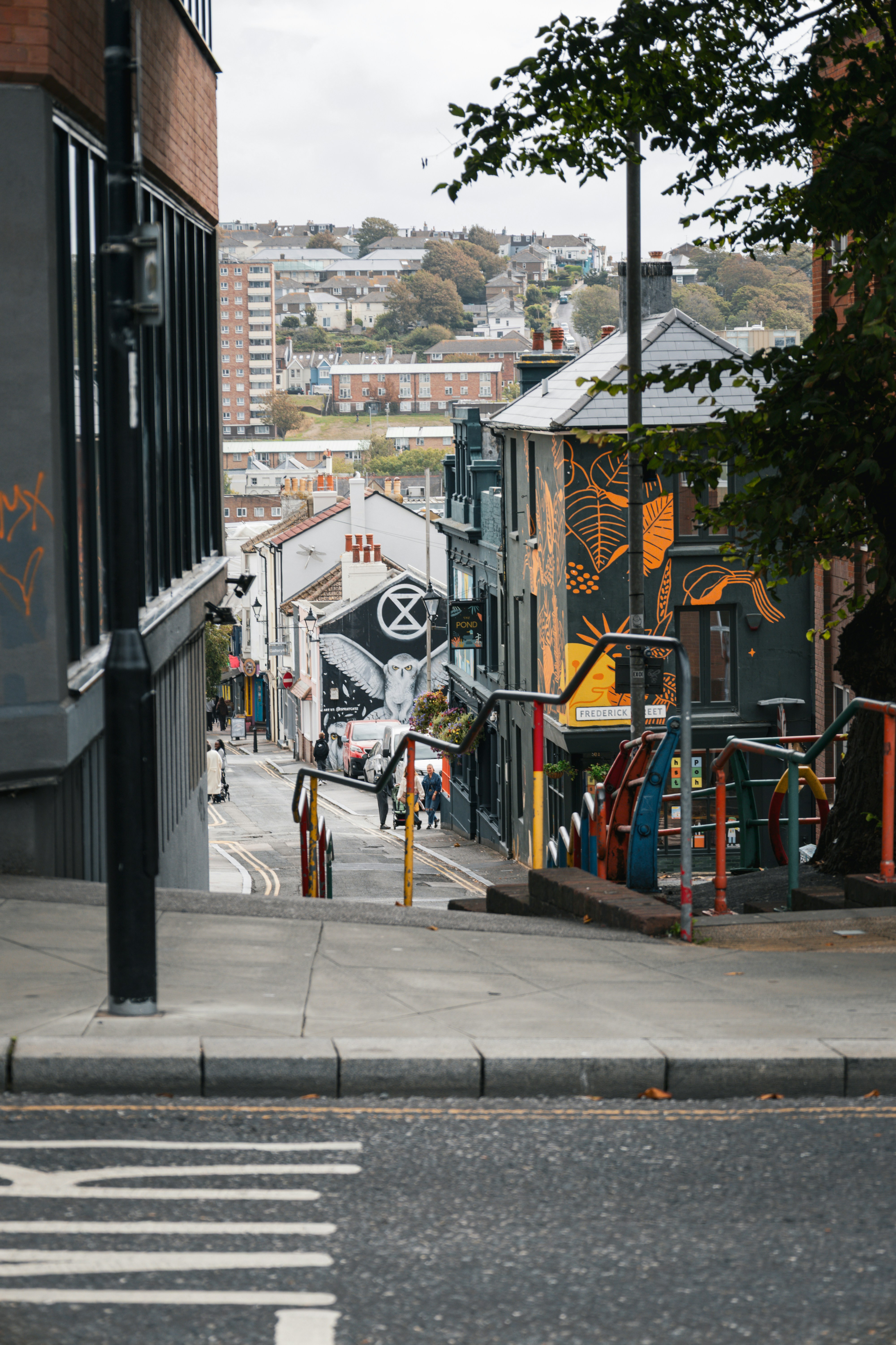 Streetscape Descent: A Colorful Alley into a Corridor of Urban Art