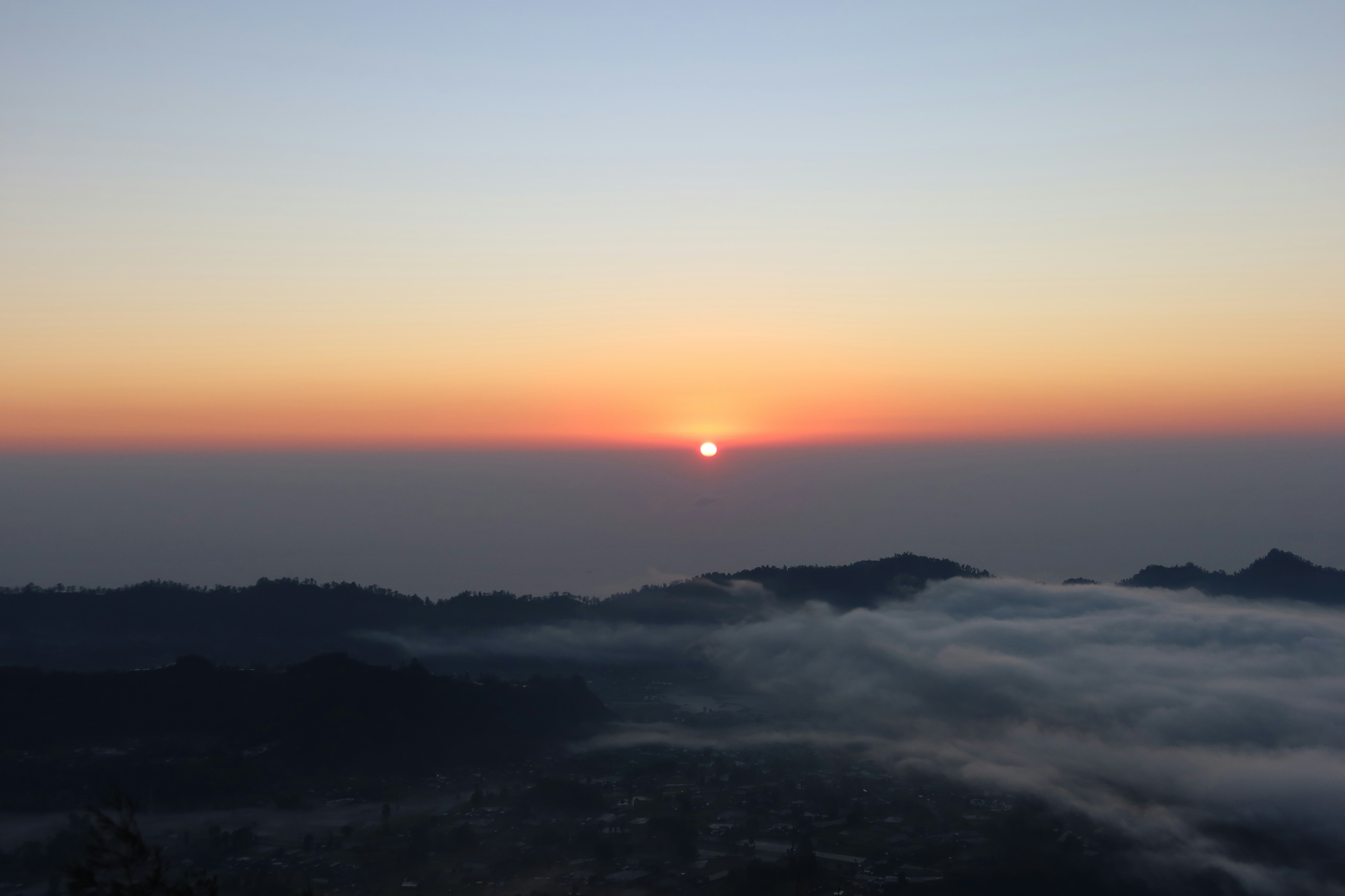 Sunrise Over Misty Hills: A Quiet Horizon Above the Valley