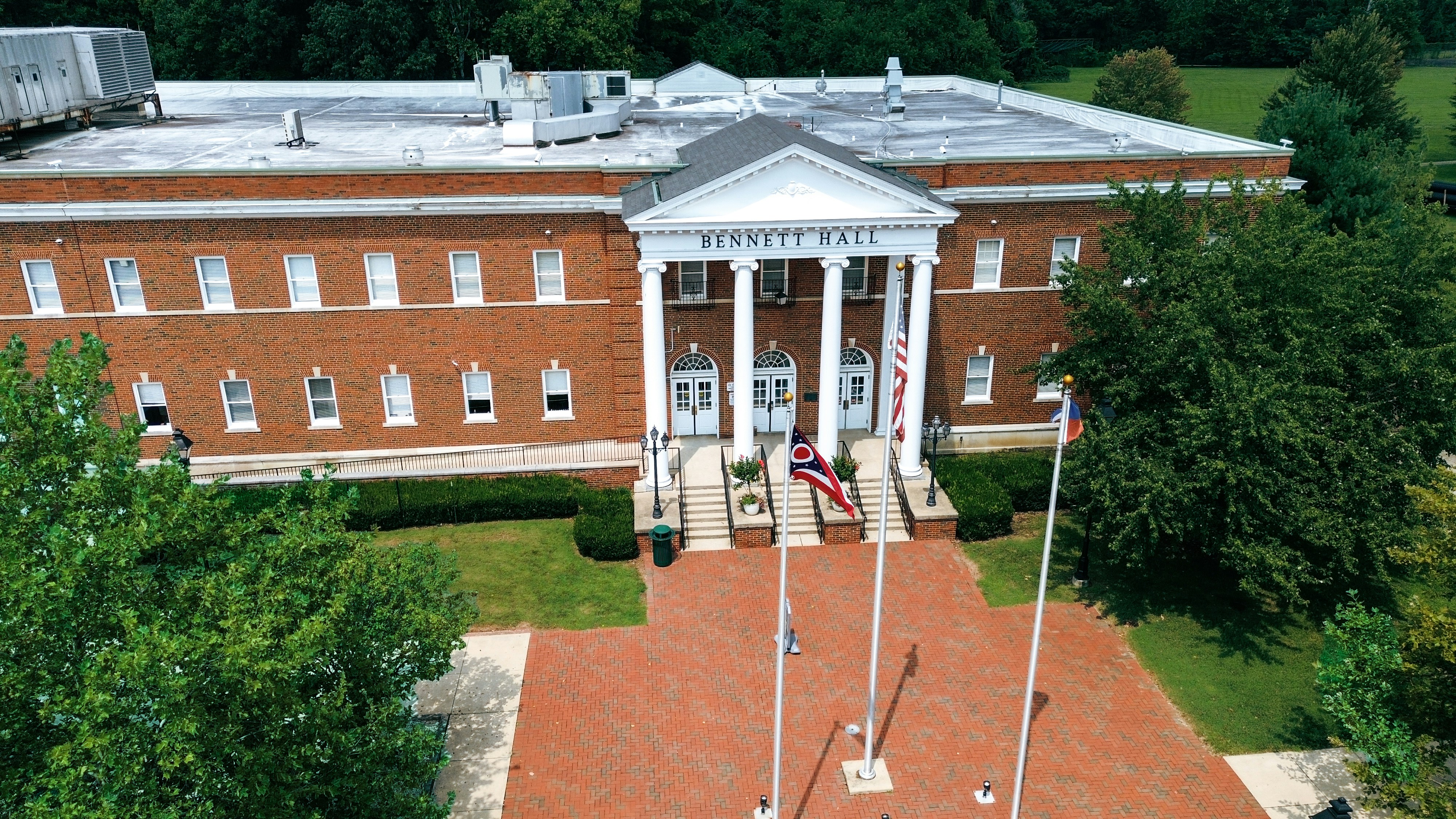 A Civic Facade: Historic Brick Chapel Front with Flagpoles