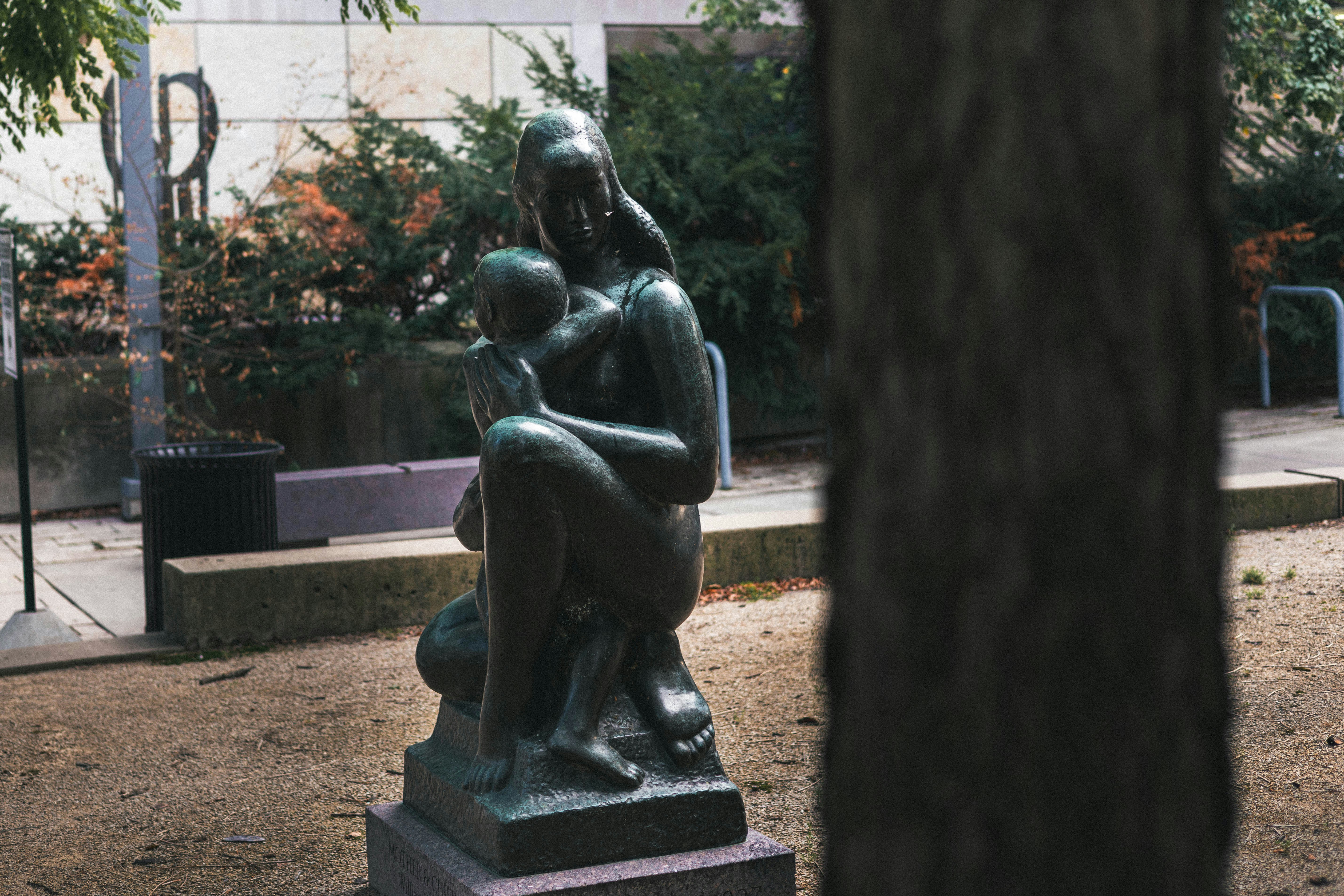 Sculpted Care: A Quiet Embrace in the Park