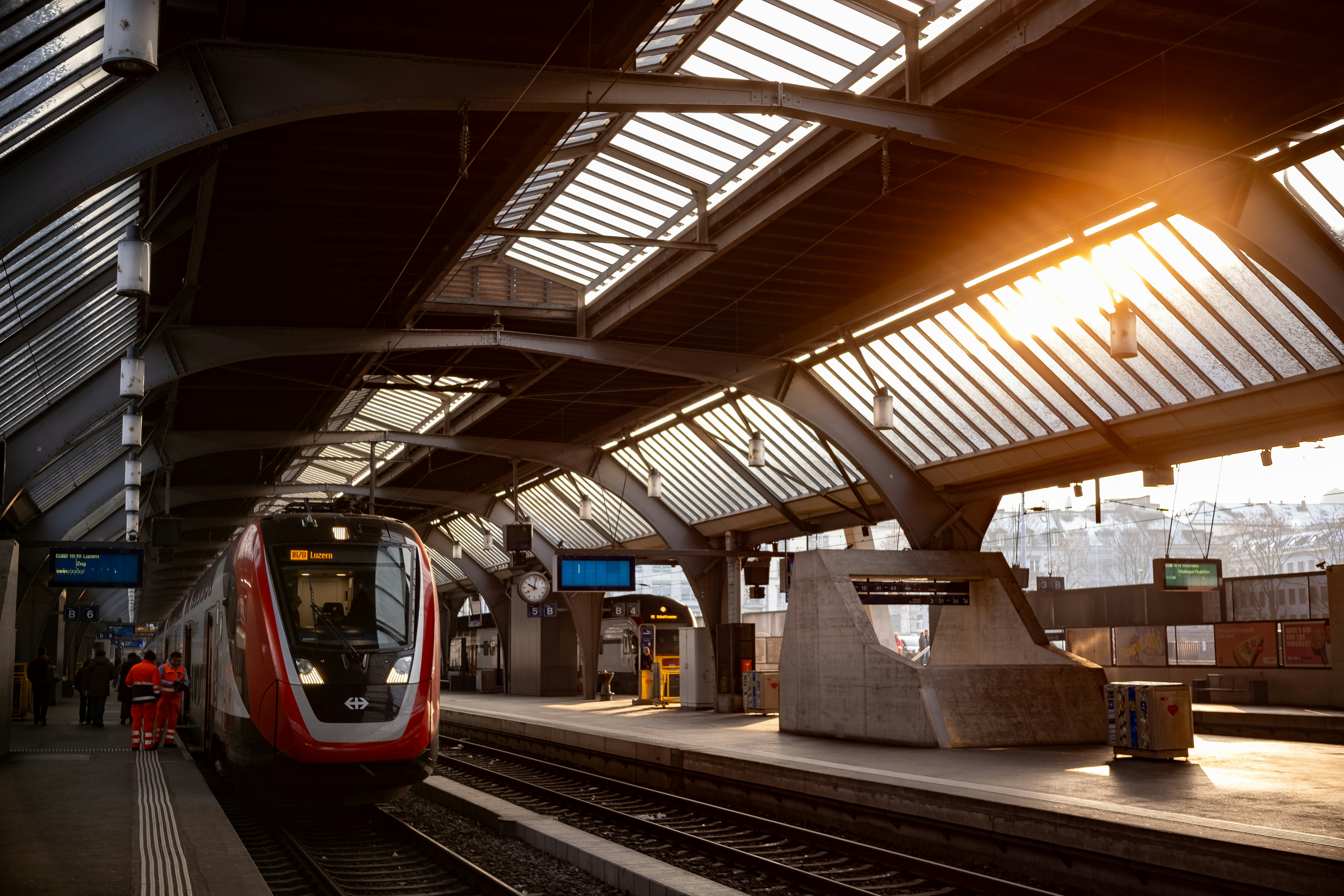 Sunlit Platform Dawn with Modern Red Train