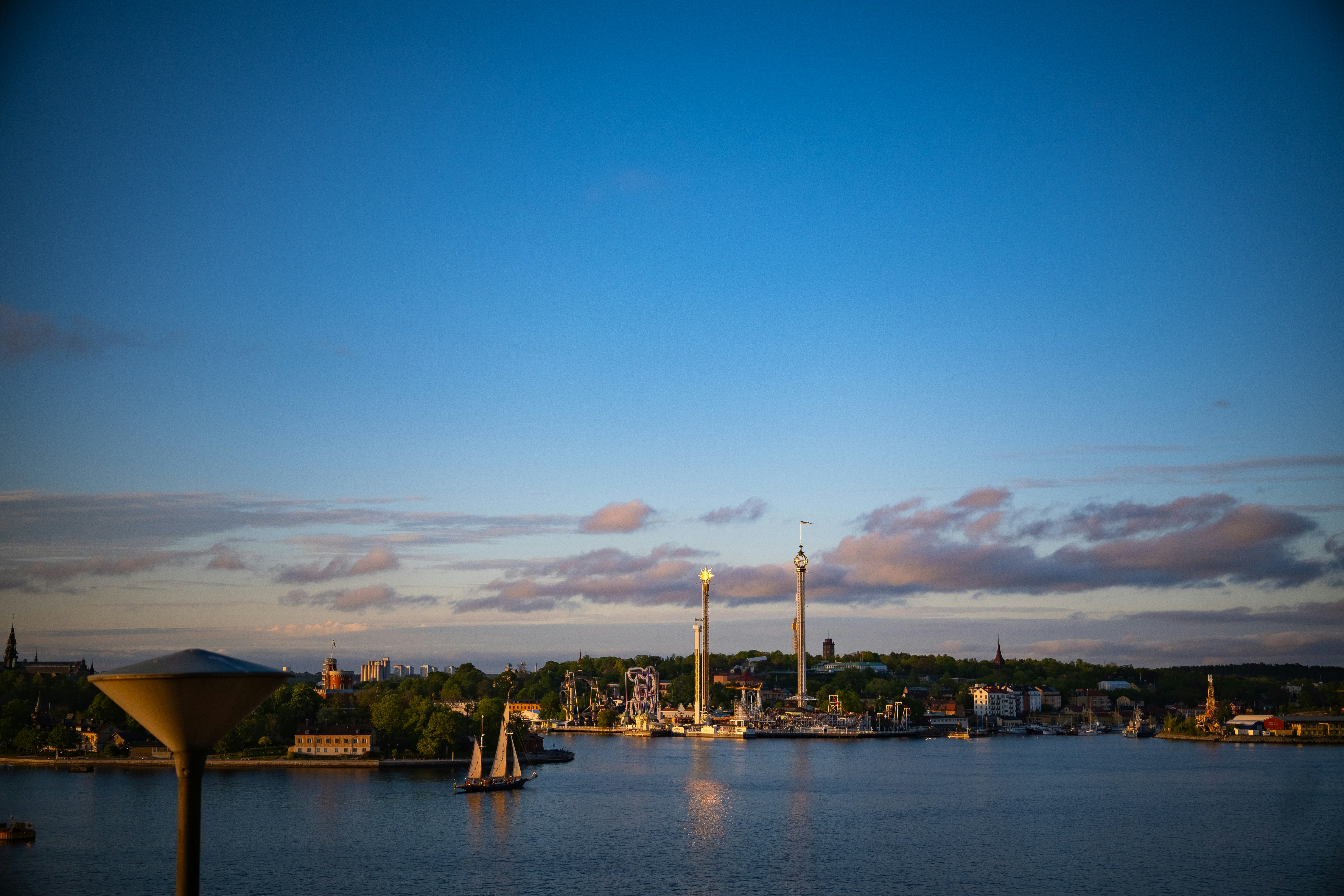 Harbor Silhouette at Dusk: Factory Spires and Calm Water