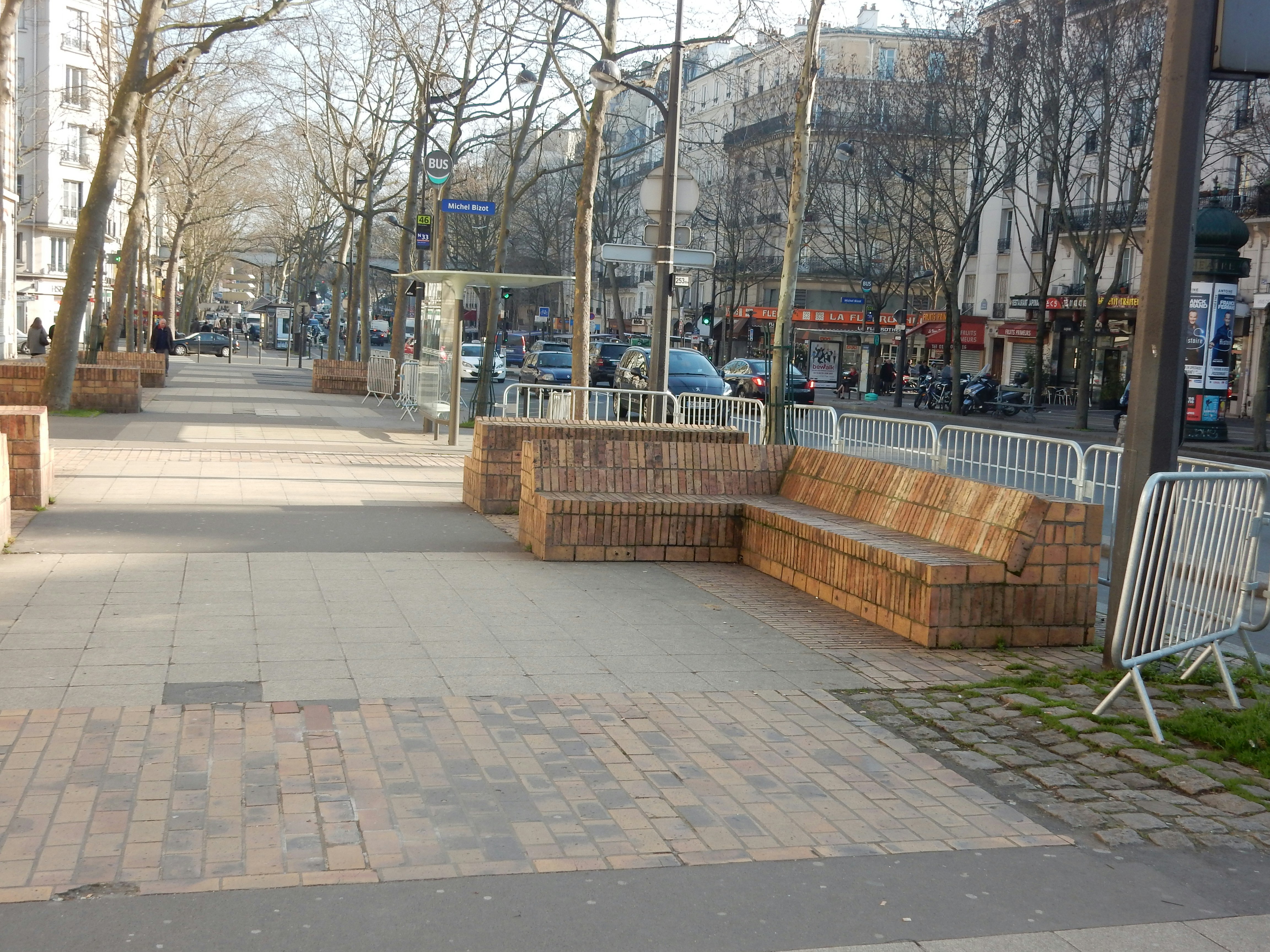 Sunlit City Walkway: Quiet Plazas and Moving Cabs