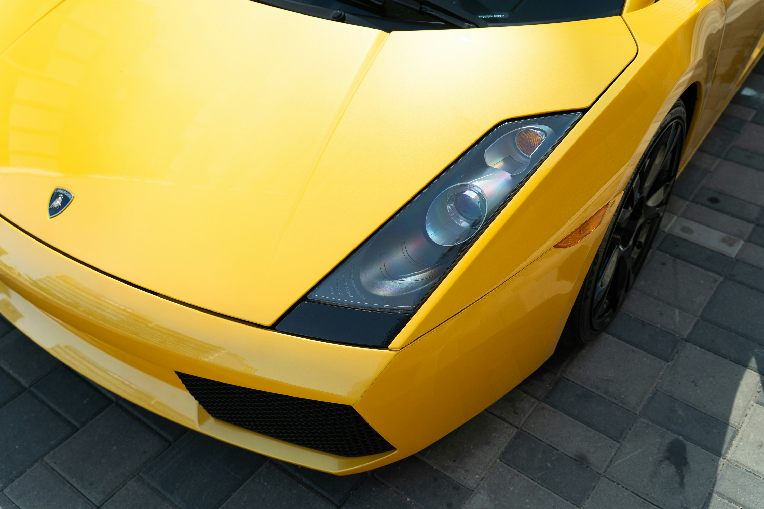 Sunlit Apex: The Yellow Vantage of a Lamborghini