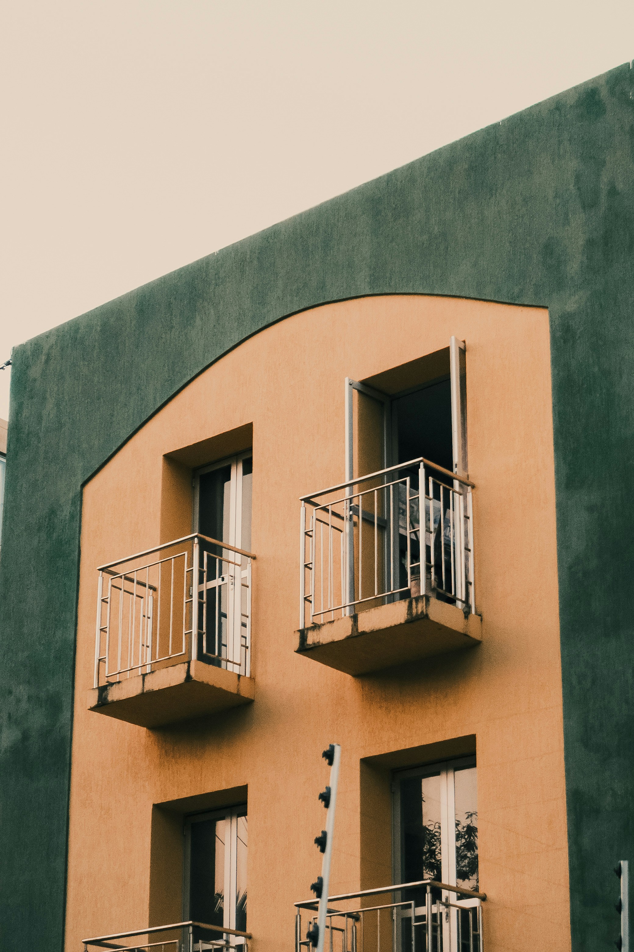 Balcony Echoes on a Painted Facade