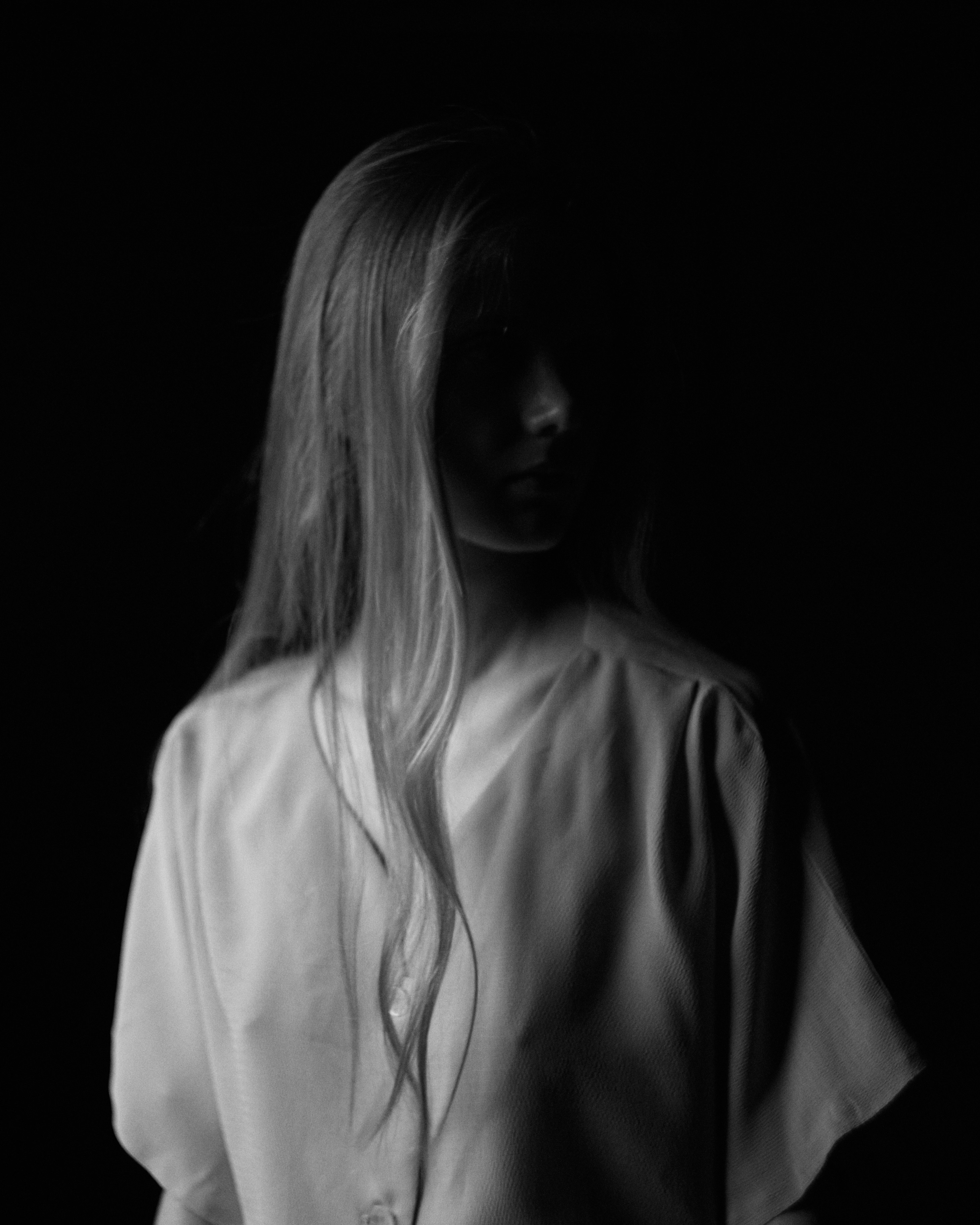 Shadowed Gaze: A Quiet Portrait in Low Key Light