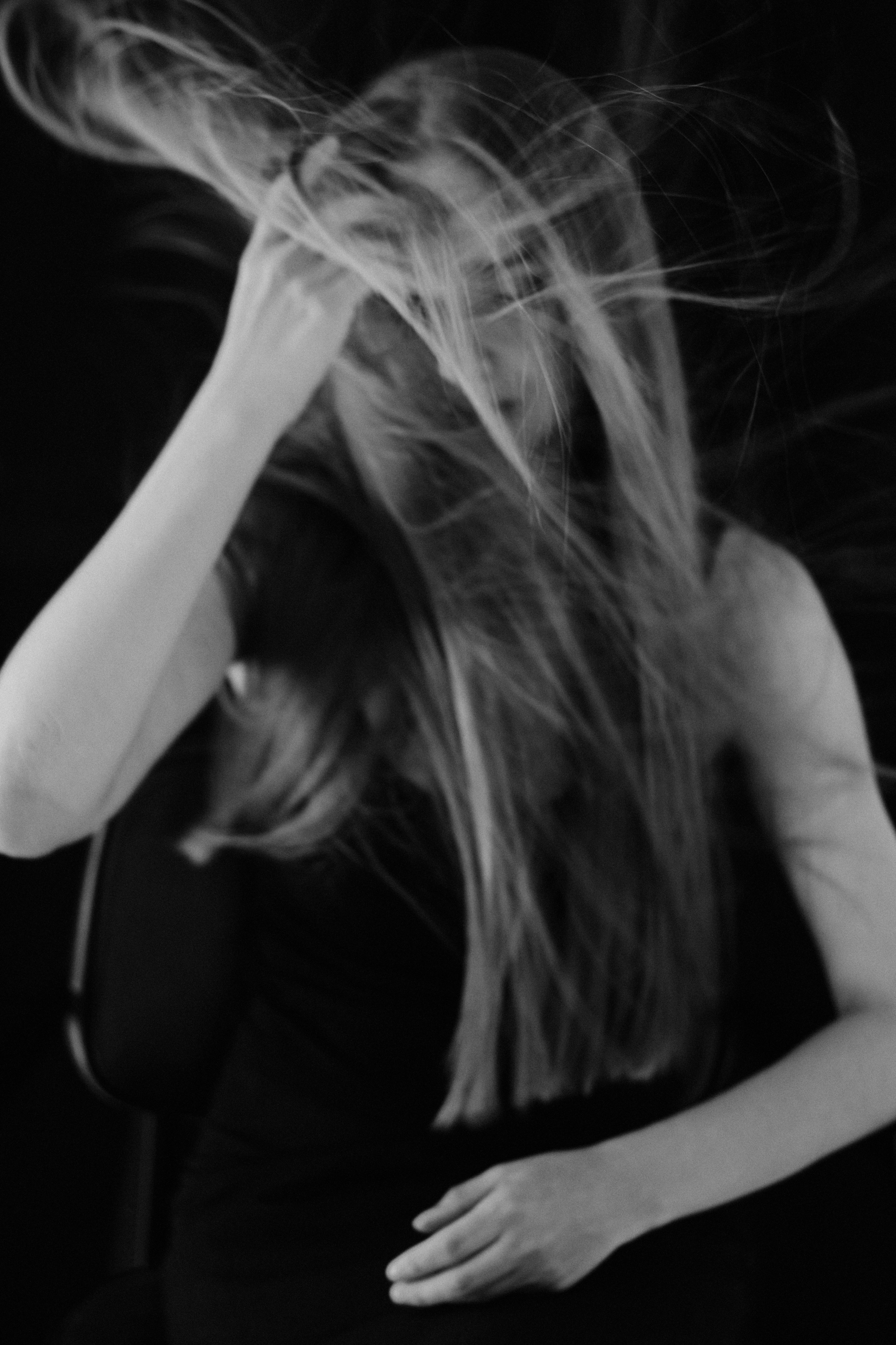 Hair in Motion: A Portrait of Hidden Face and Gesture in Black