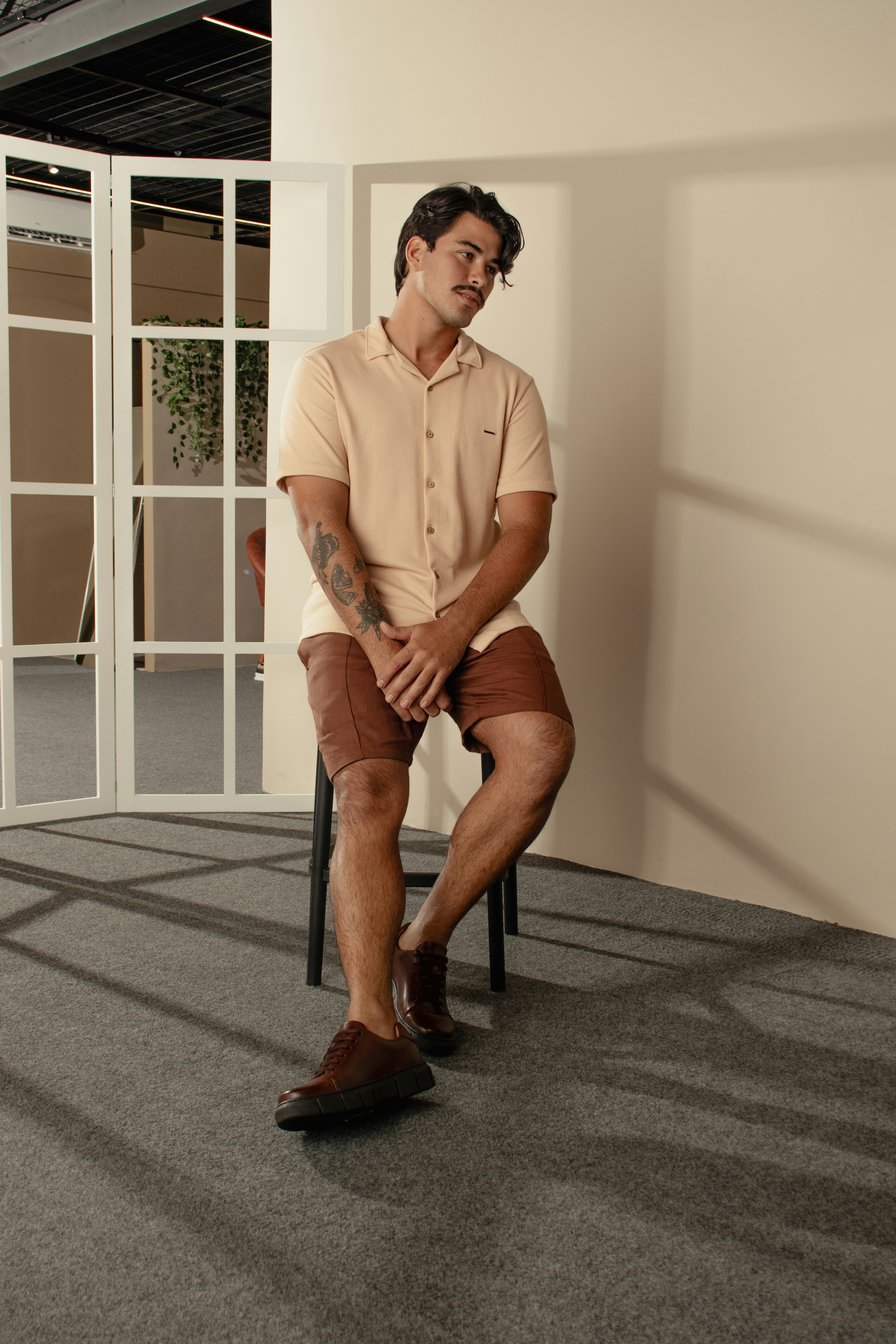Sitting in Soft Light: A Contemplative Portrait in a Minimal Studio