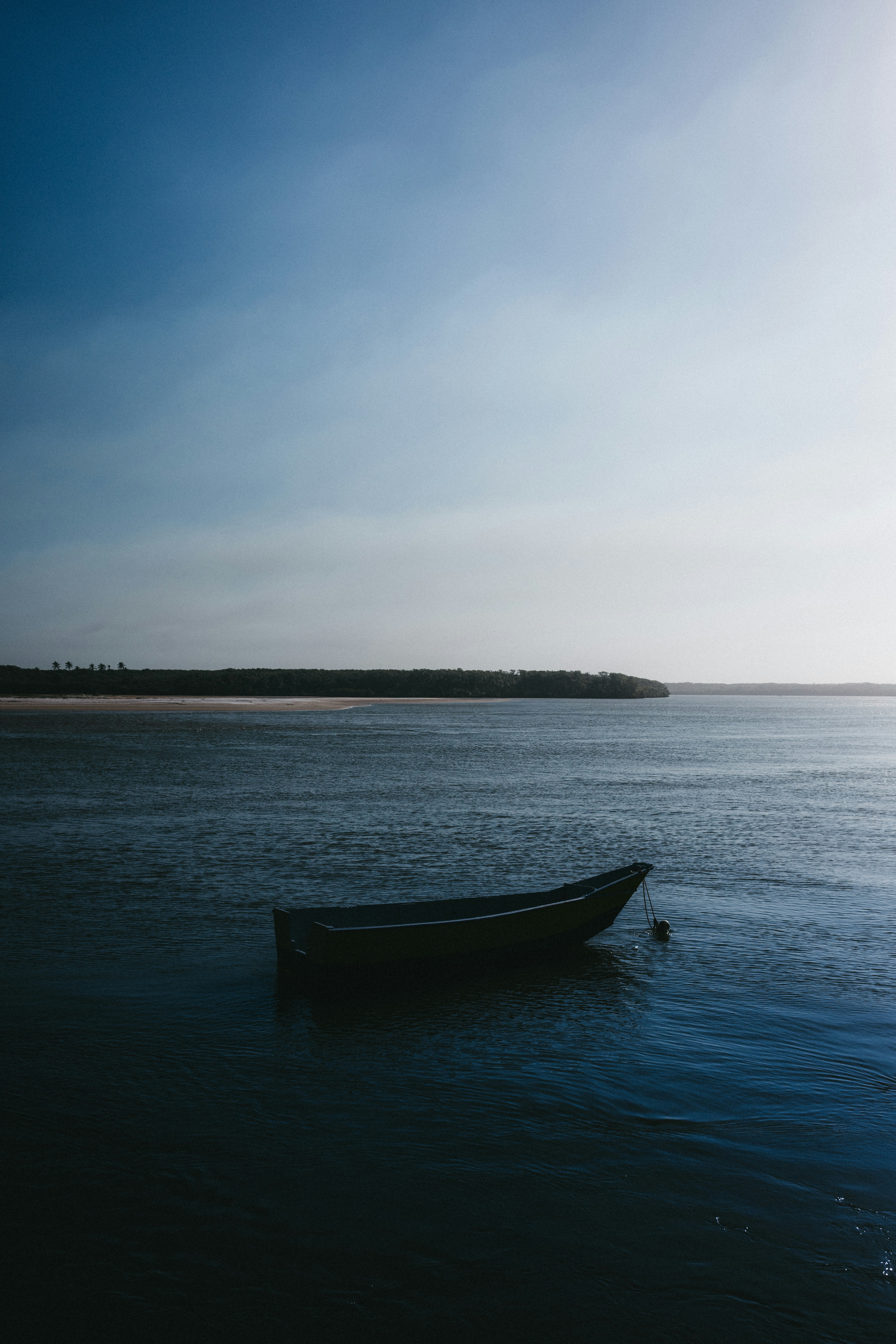 Gentle Vessel at Dusk: A Quiet Convergence of Water and Sky